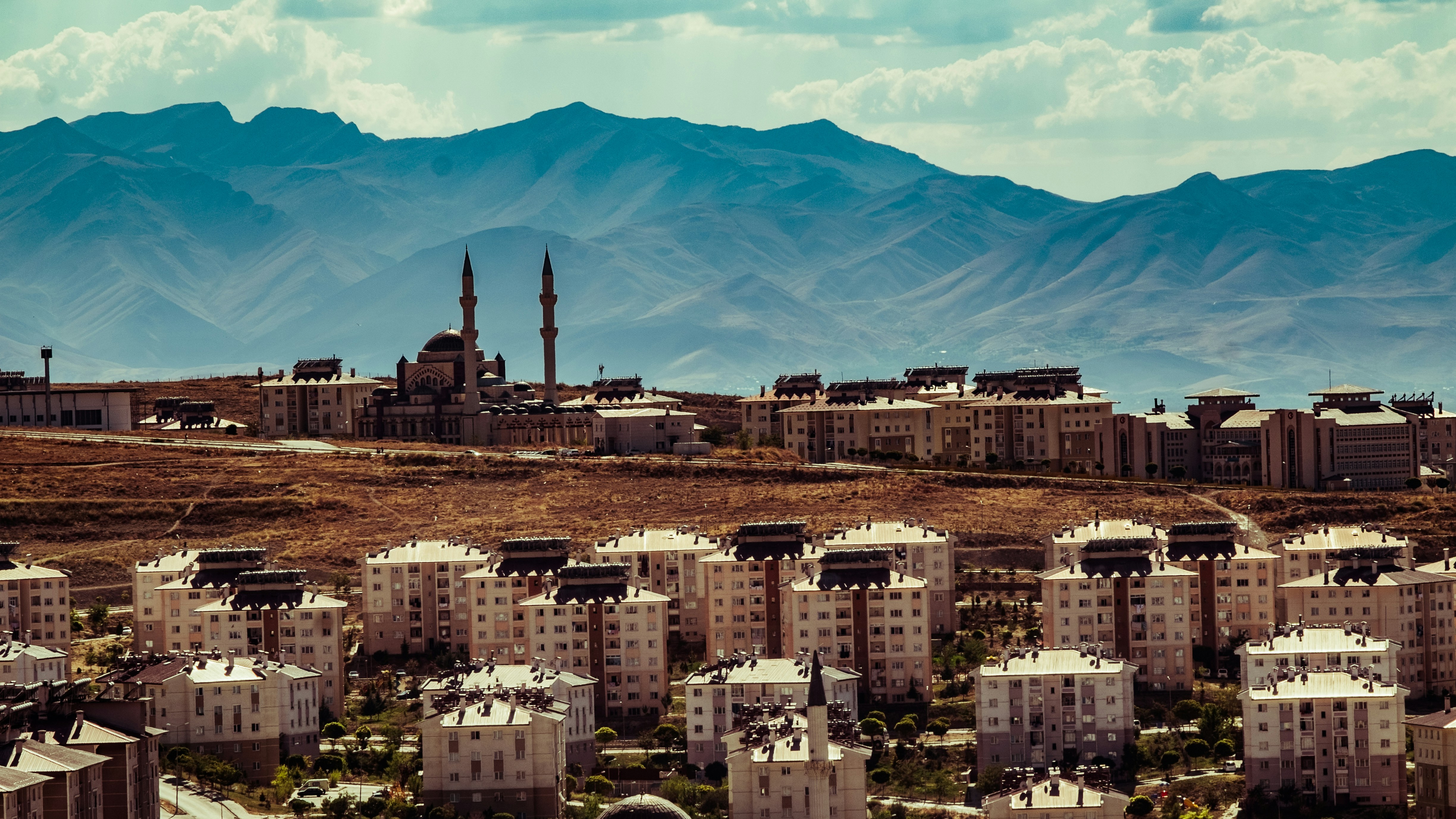 Urban Harmony Against Mountain Majesty