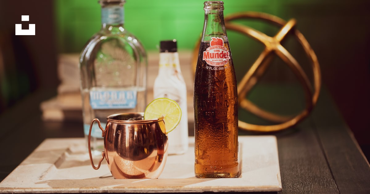 Clear Glass Bottle Beside Clear Glass Cup Photo Free Beverage Image