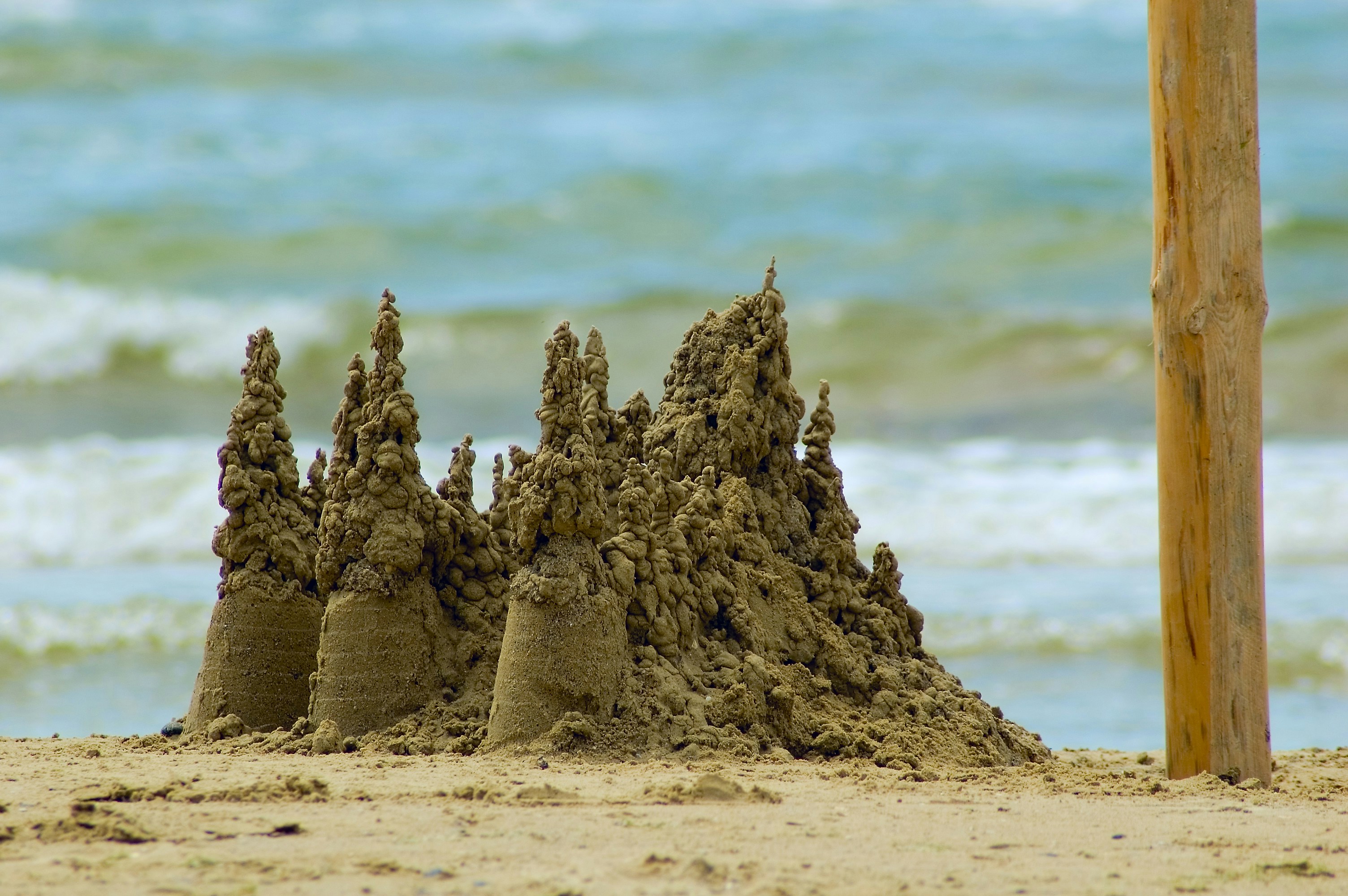 brown rock formation on brown sand during daytime