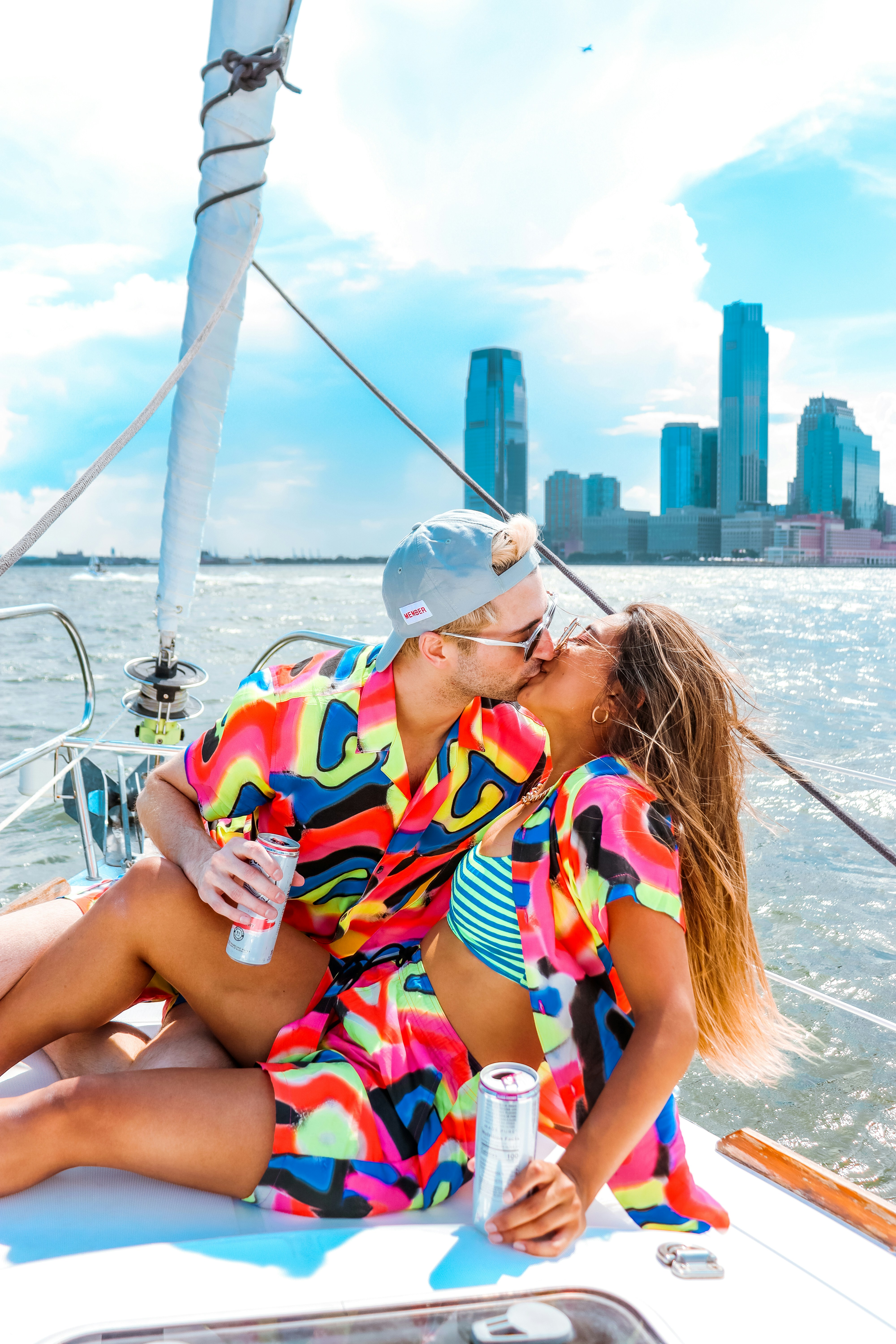 Kiss on the Wake: Neon-Clad Lovers Against a City Backdrop