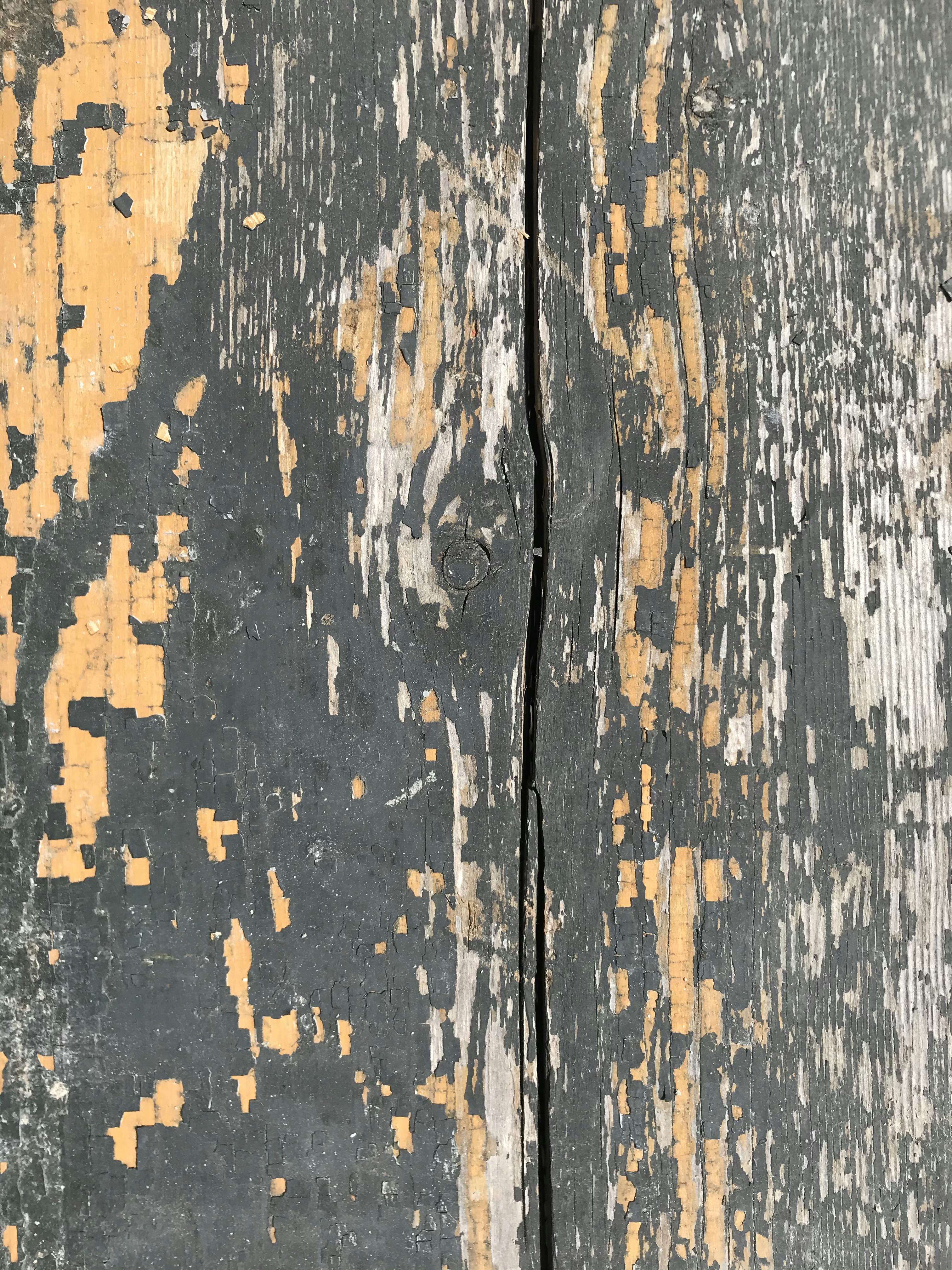 Timeworn Center: Cracked Paint and Weathered Planks in Close-Up