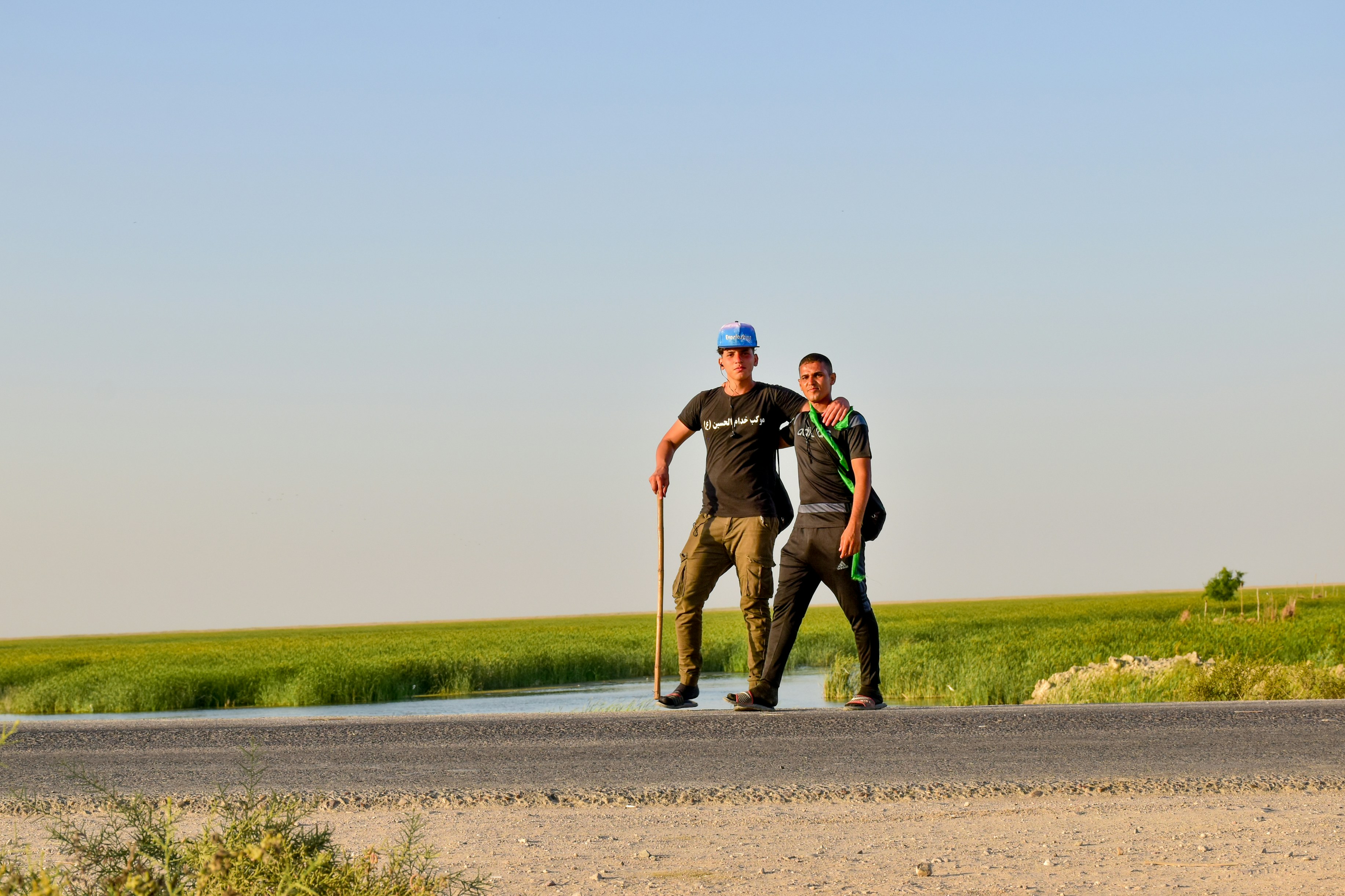 Two Travelers at the Edge of a Tundra–Grass Plain