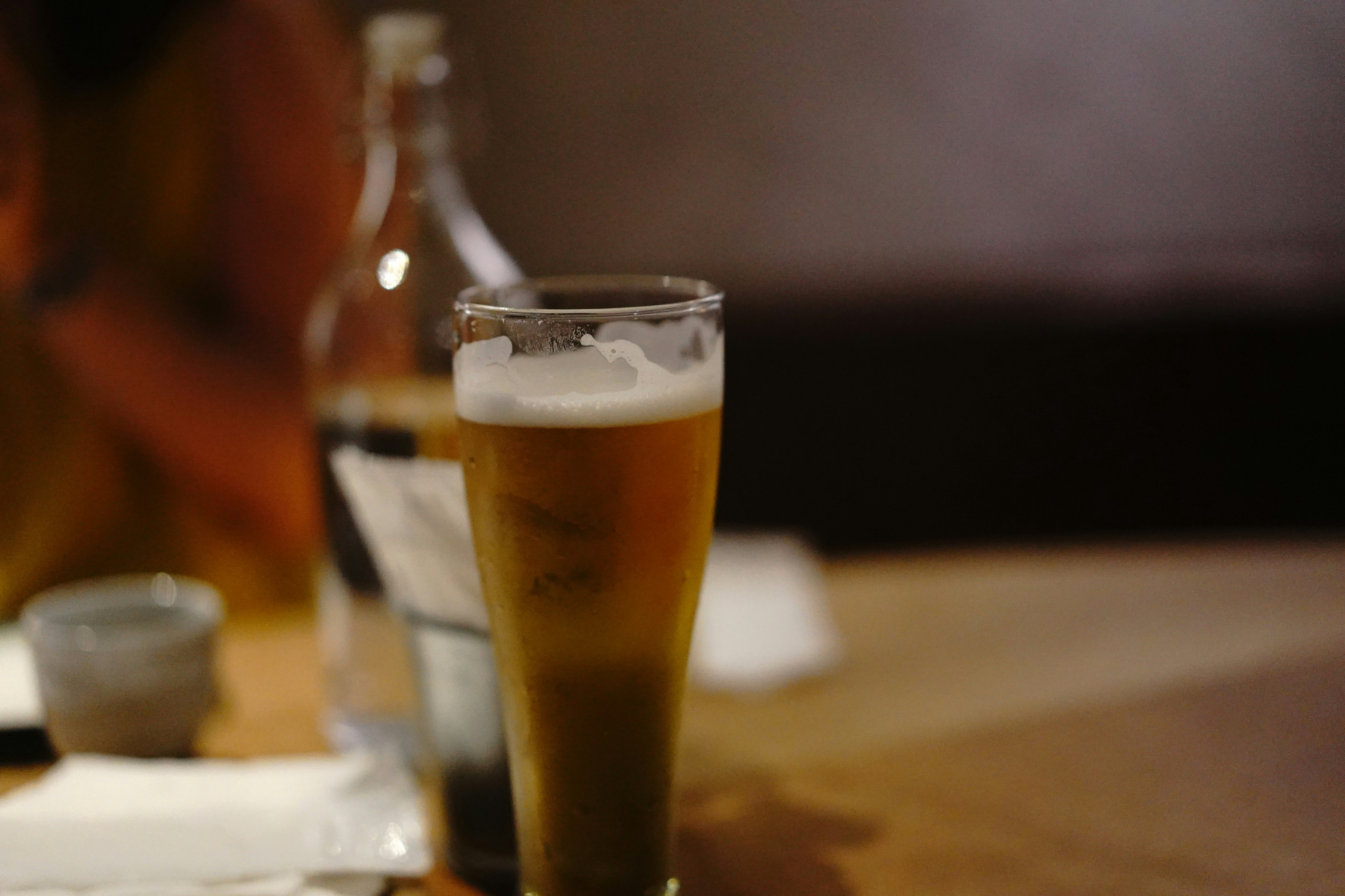 A close up of a glass of beer on a table photo – Free Beer Image on ...