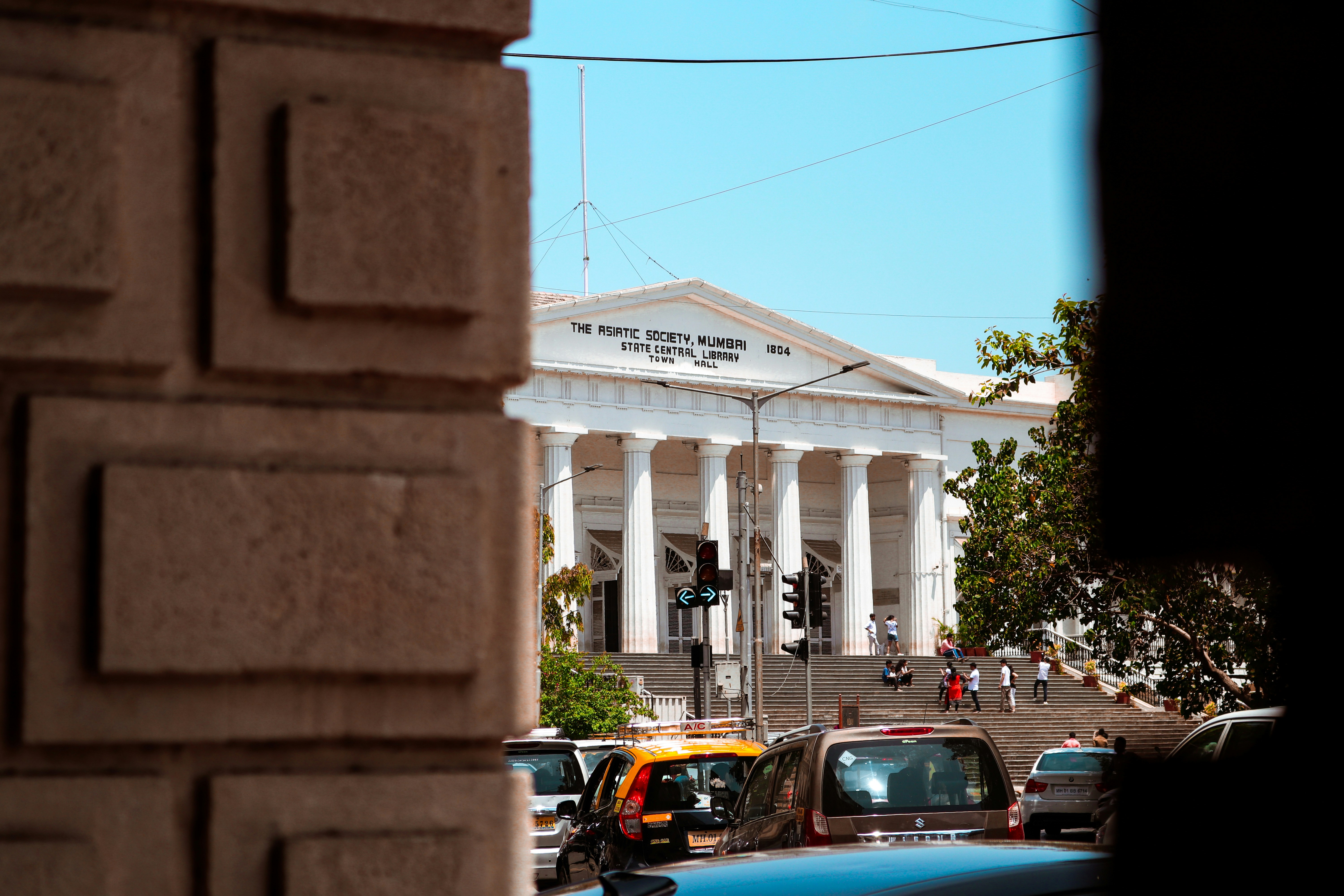 The Asiatic Society Of Mumbai State Central Library | cars parked in front of white concrete building during daytime