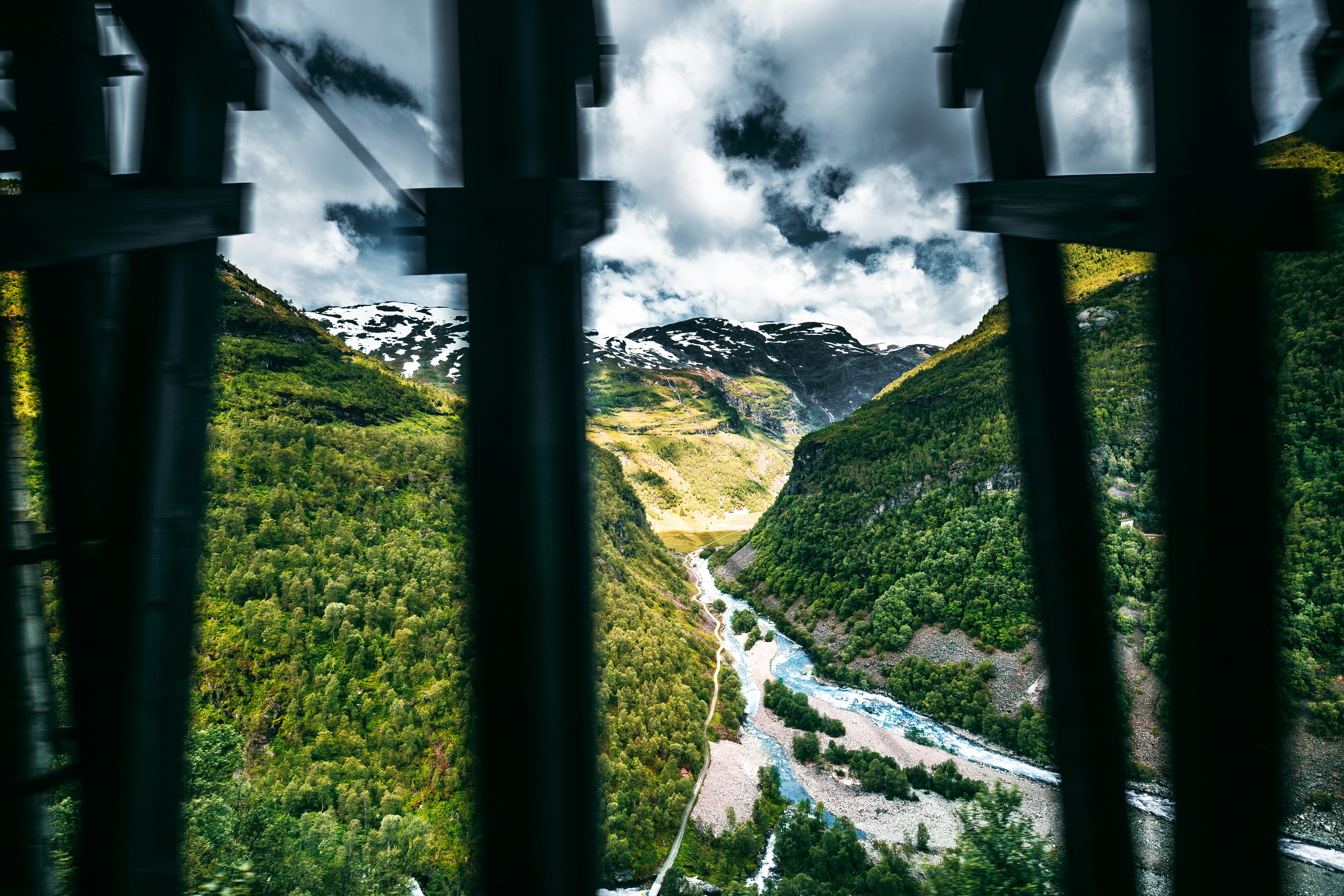 Through the Rails: A Glimpse into Norway's Verdant Valleys