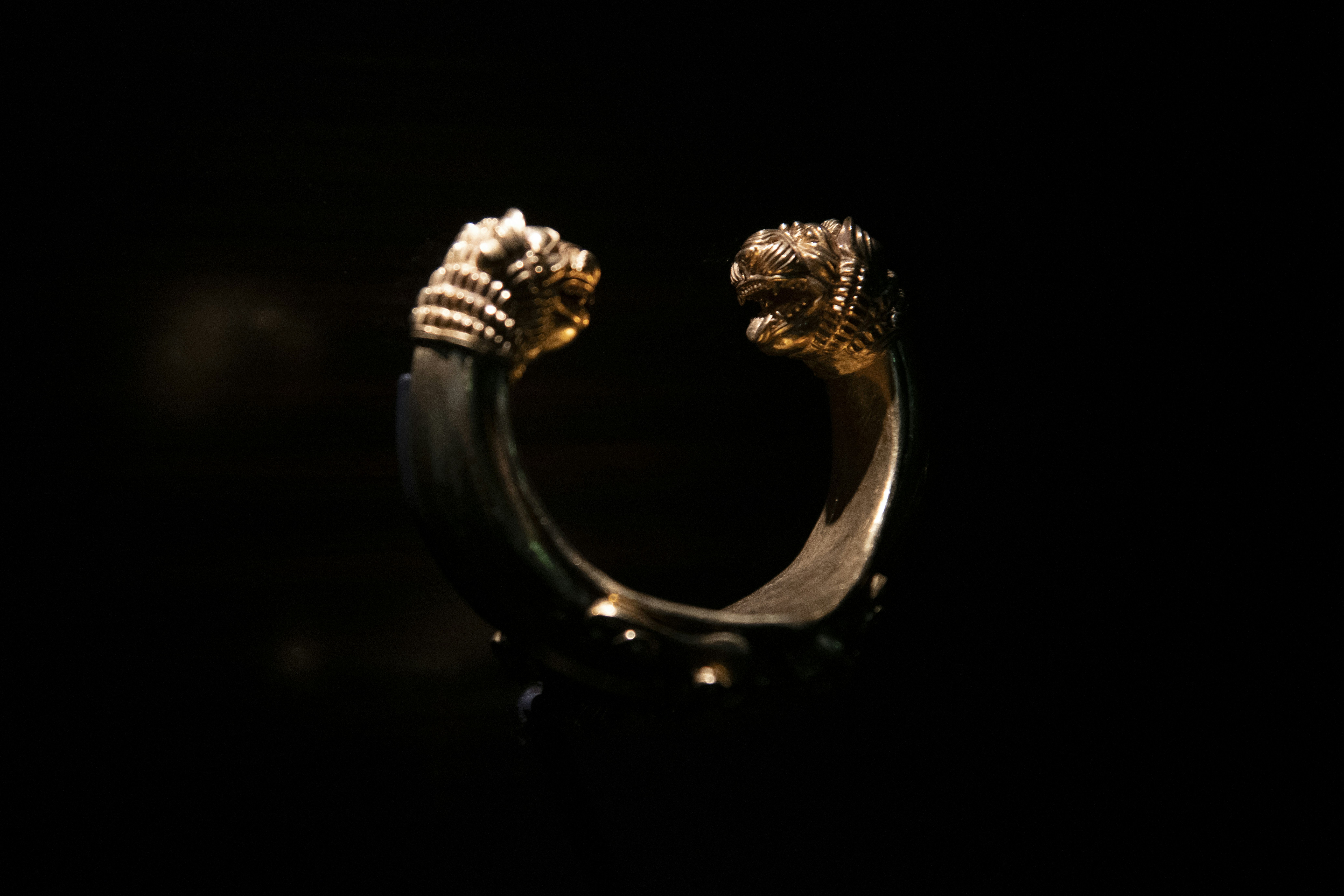 gold ring with black background