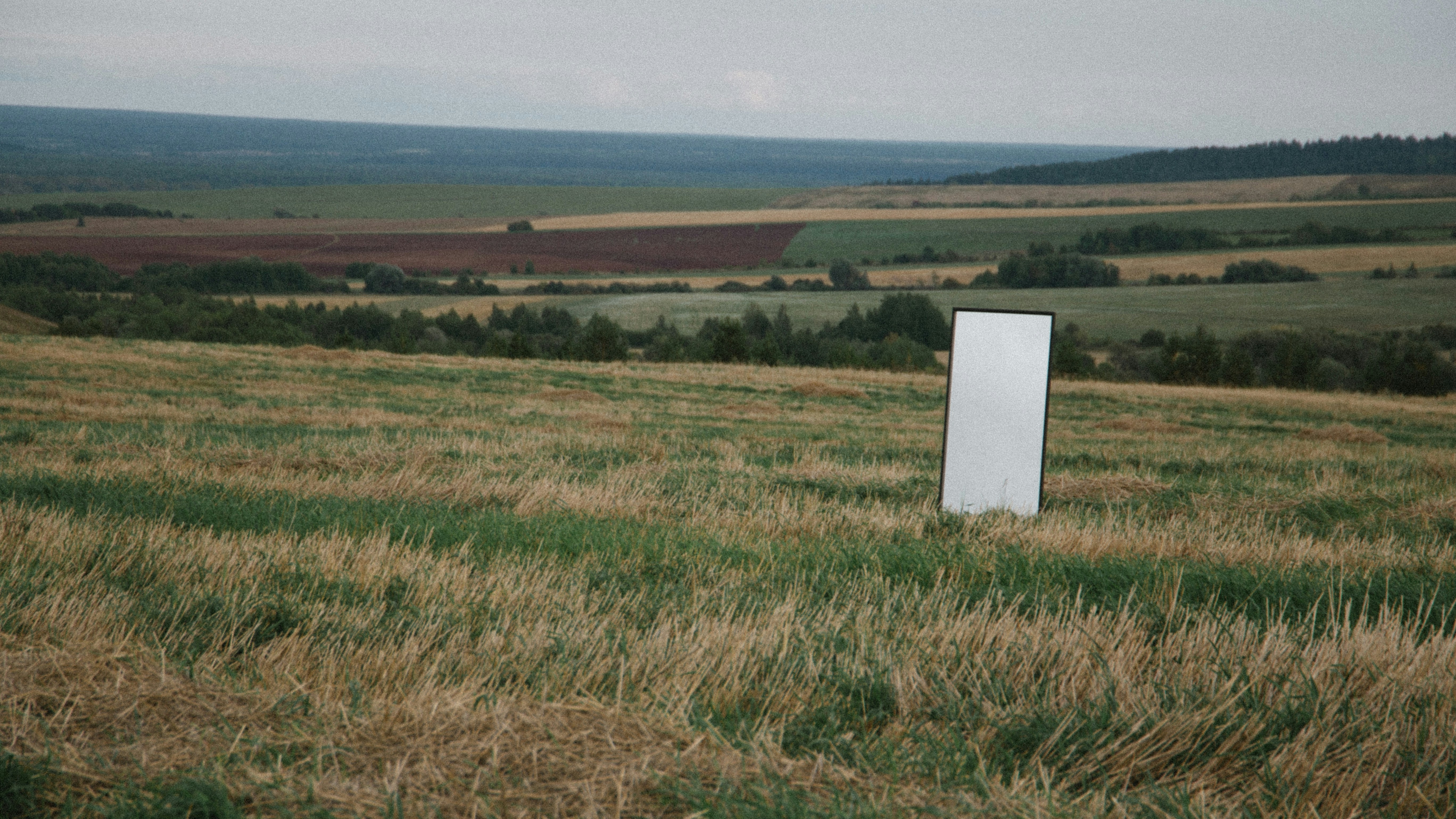 white box on brown grass field during daytime