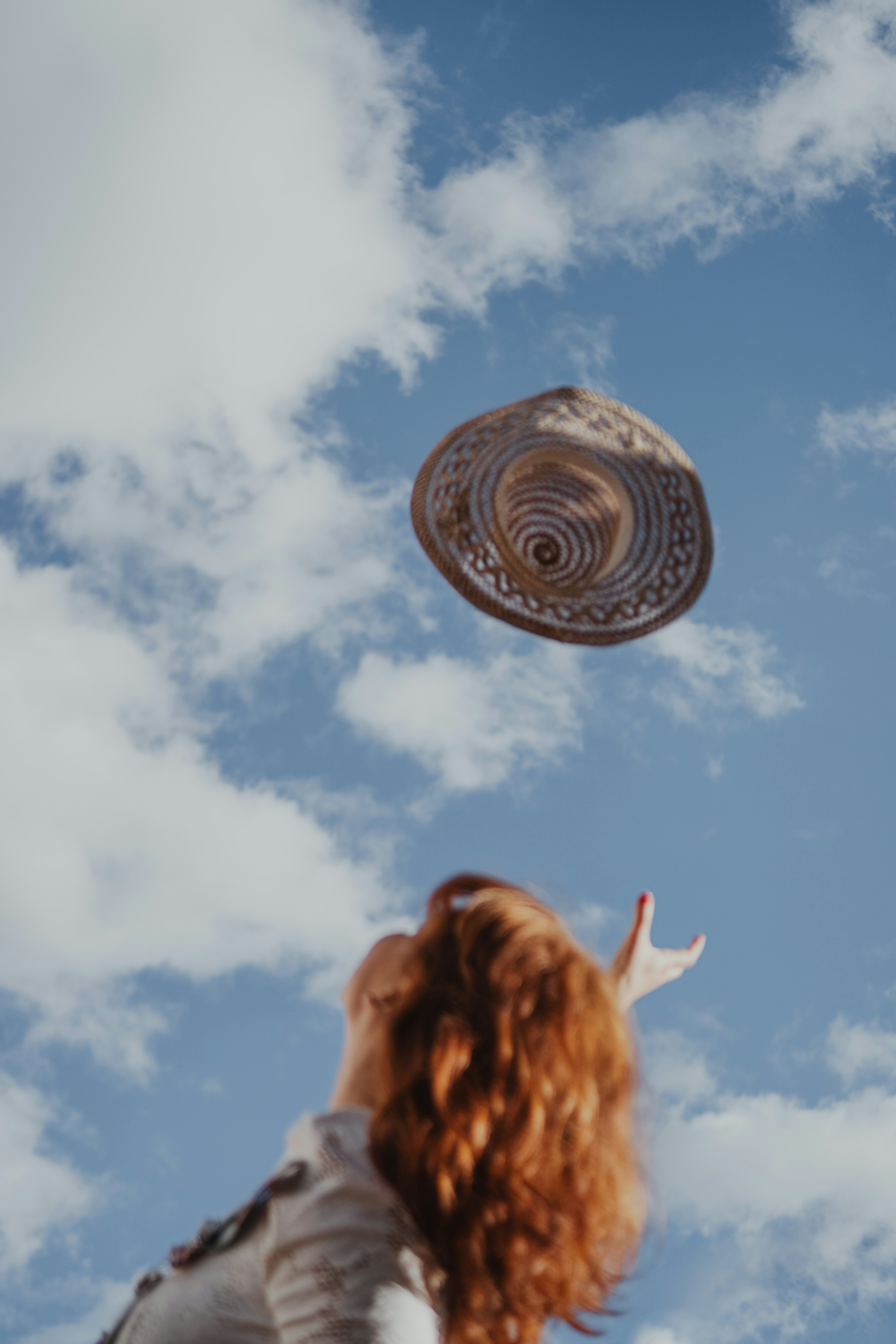 Hat Takeoff under a Blue Sky: A Moment of Flight
