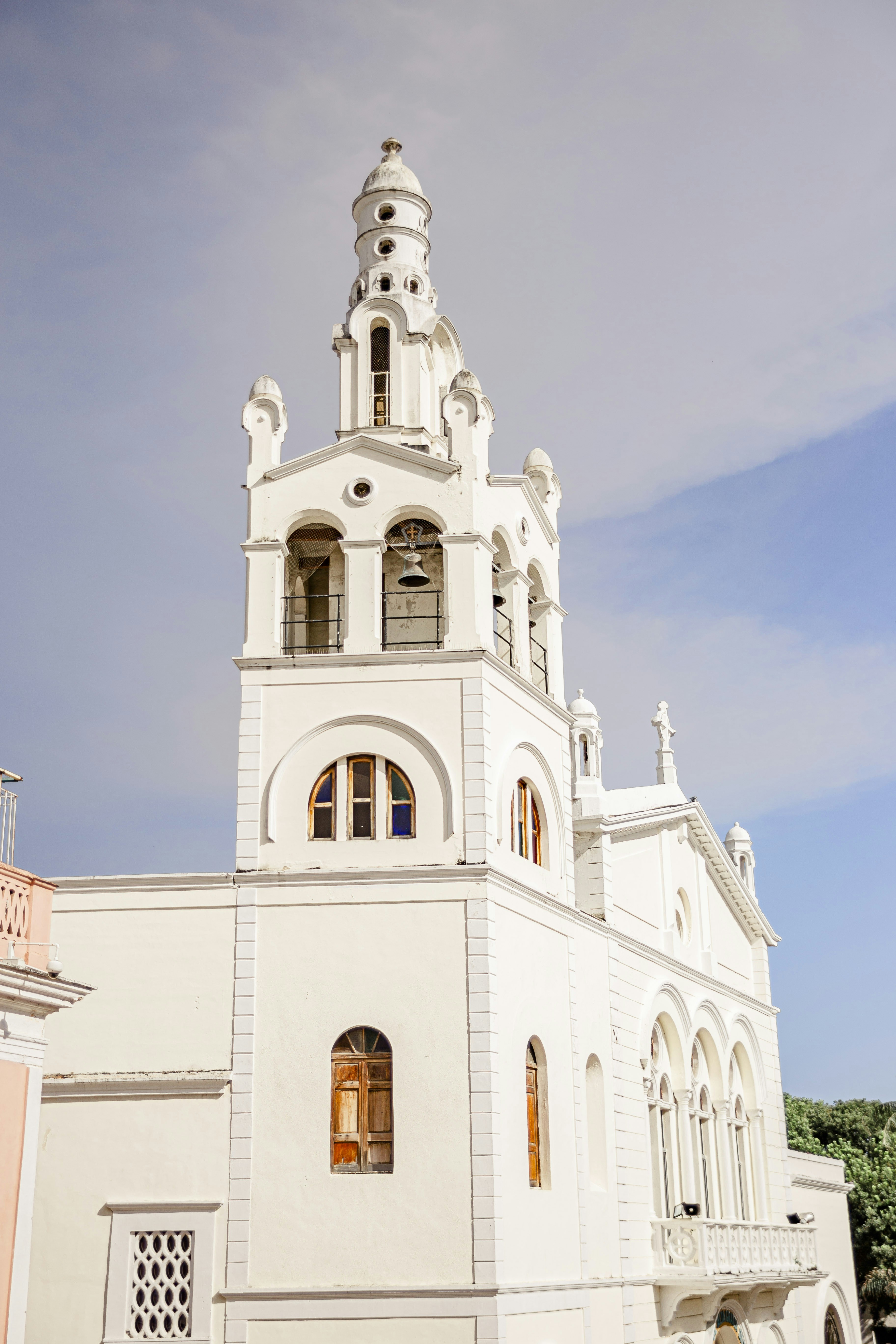 White concrete church under blue sky during daytime photo – Free Zona ...
