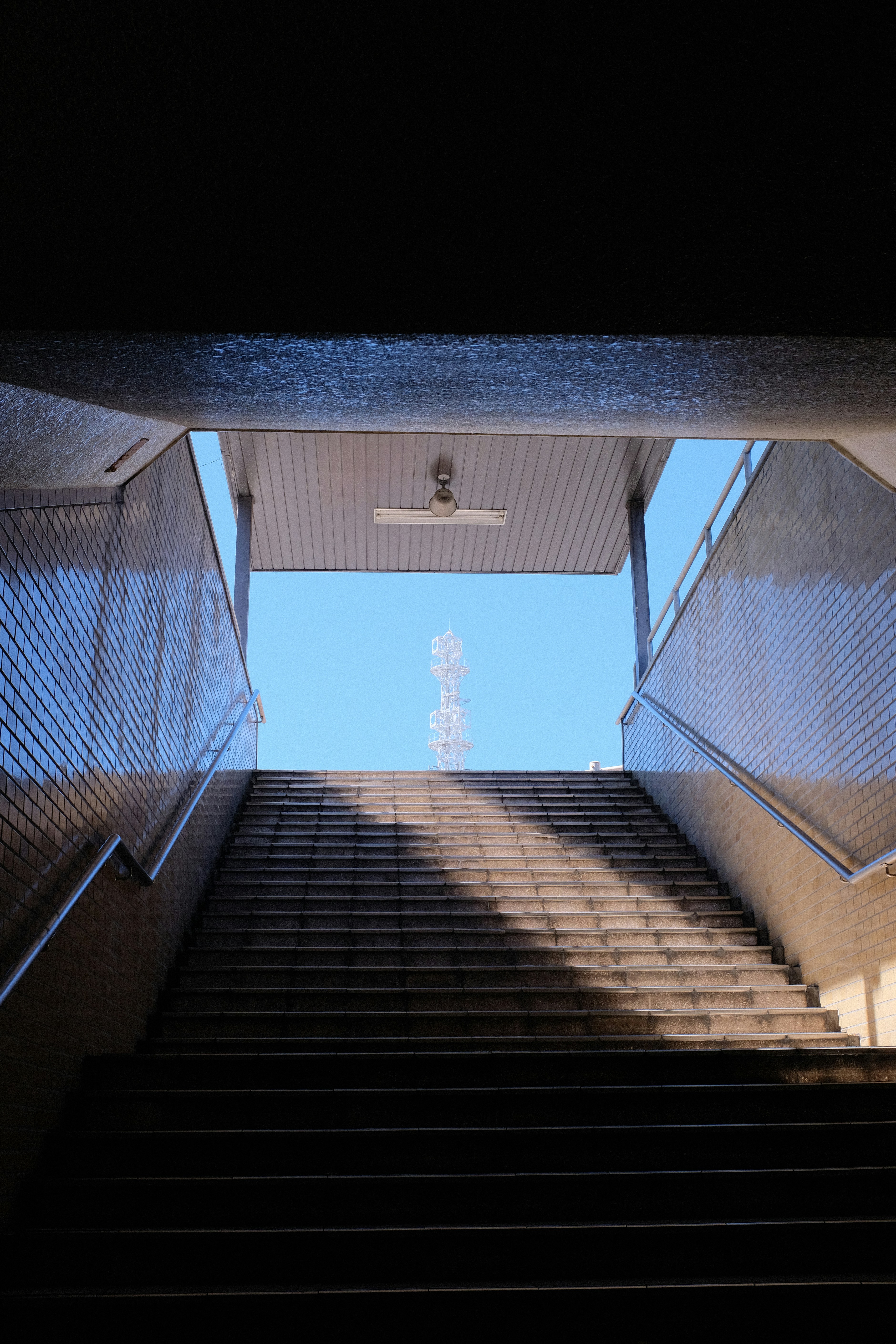 Ascending Light: Stairwell Framing Toward the Sky