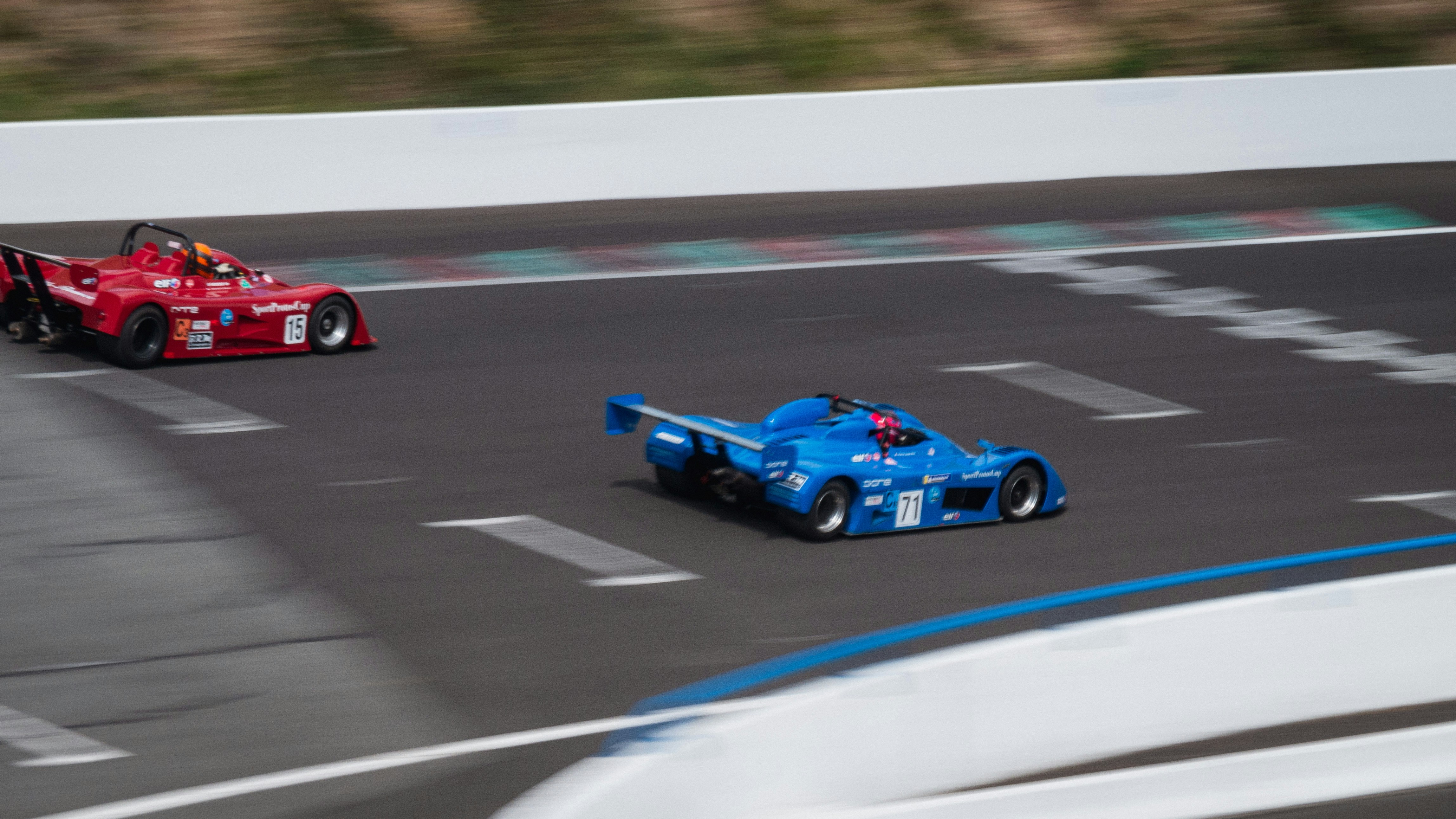 Red and blue racing car on track photo – Free Circuit de charade Image ...