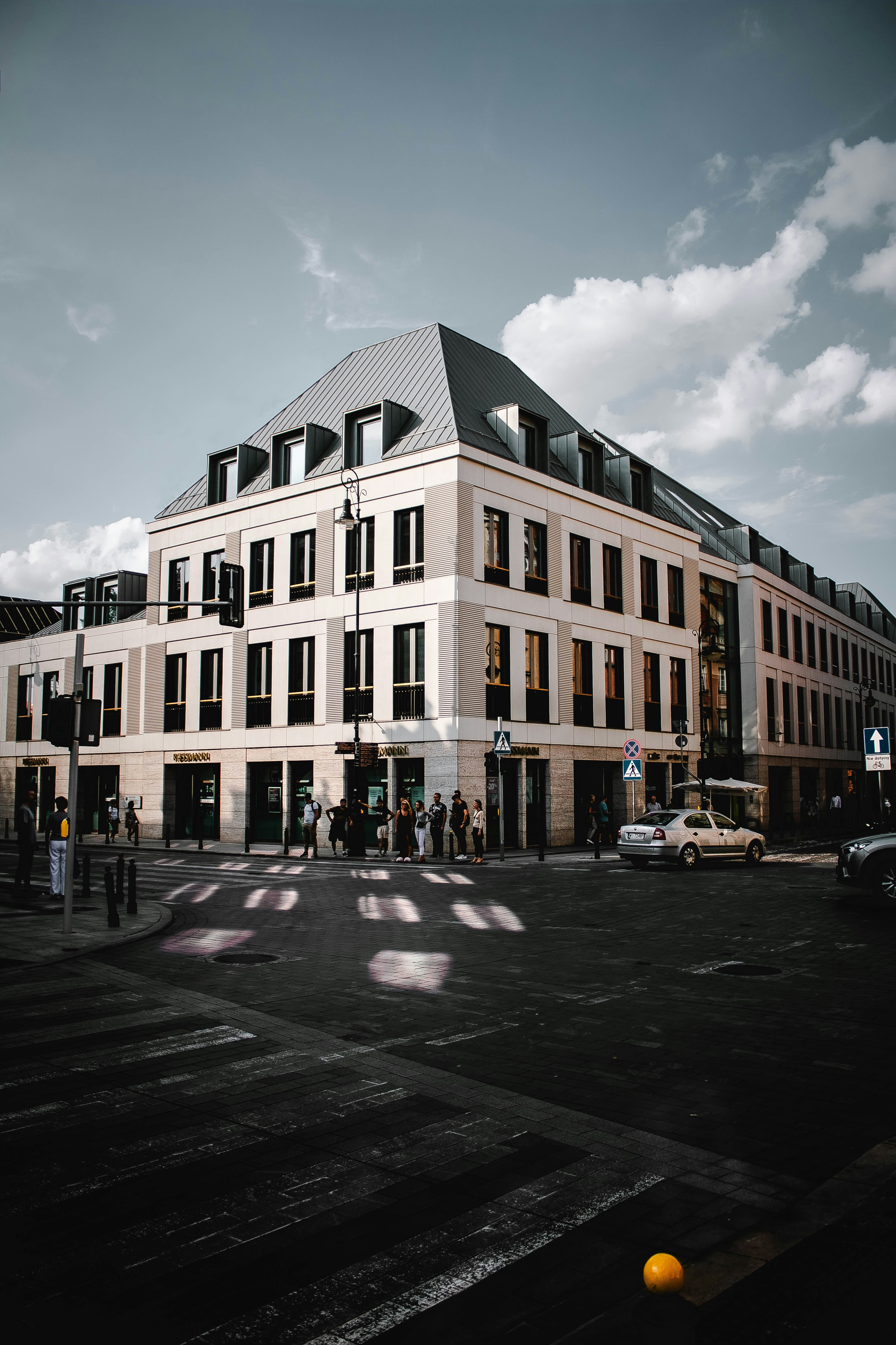 Corner Facade at a Sunlit City Crossing