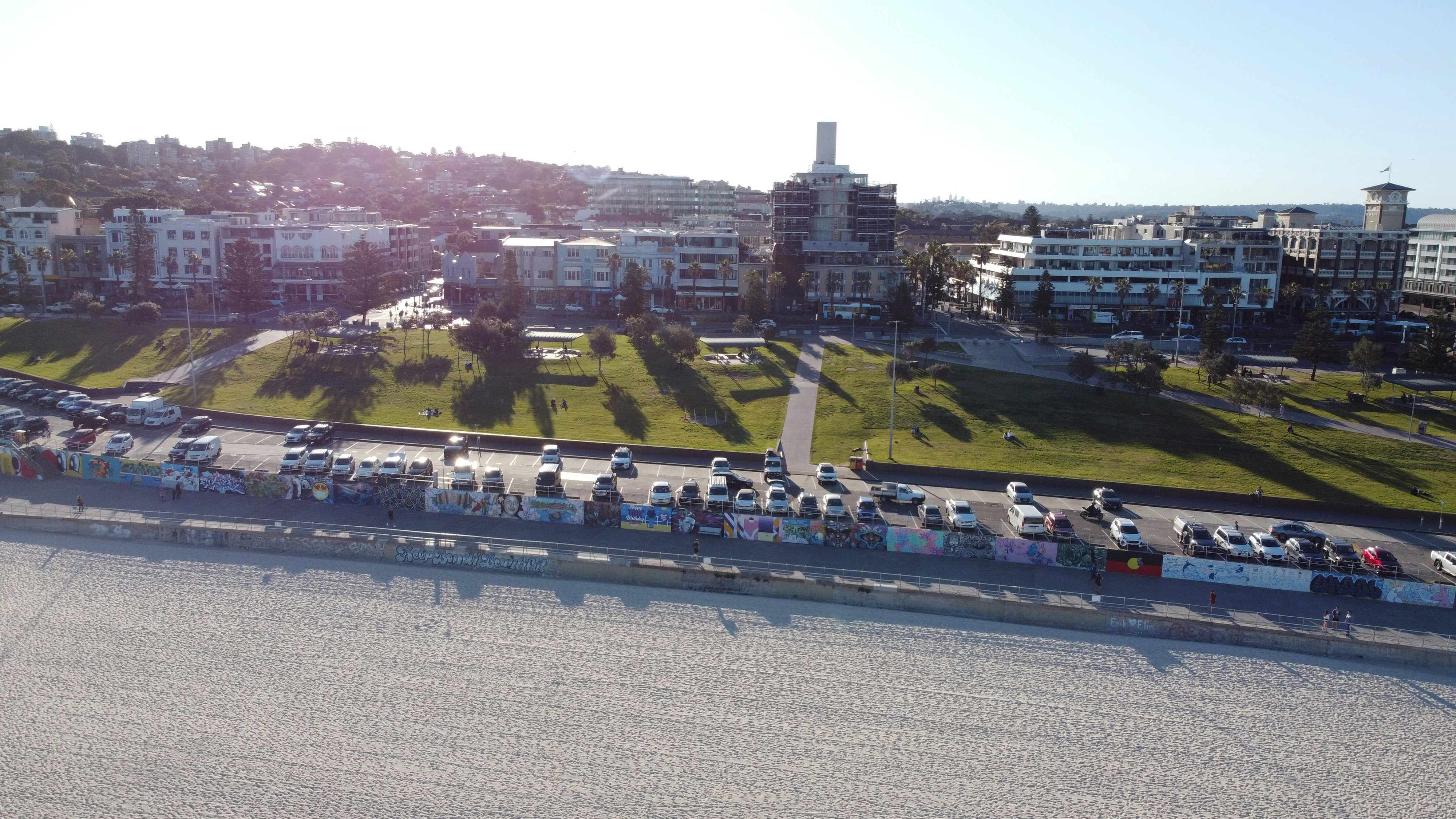Cars parked on parking lot near city buildings during daytime photo ...