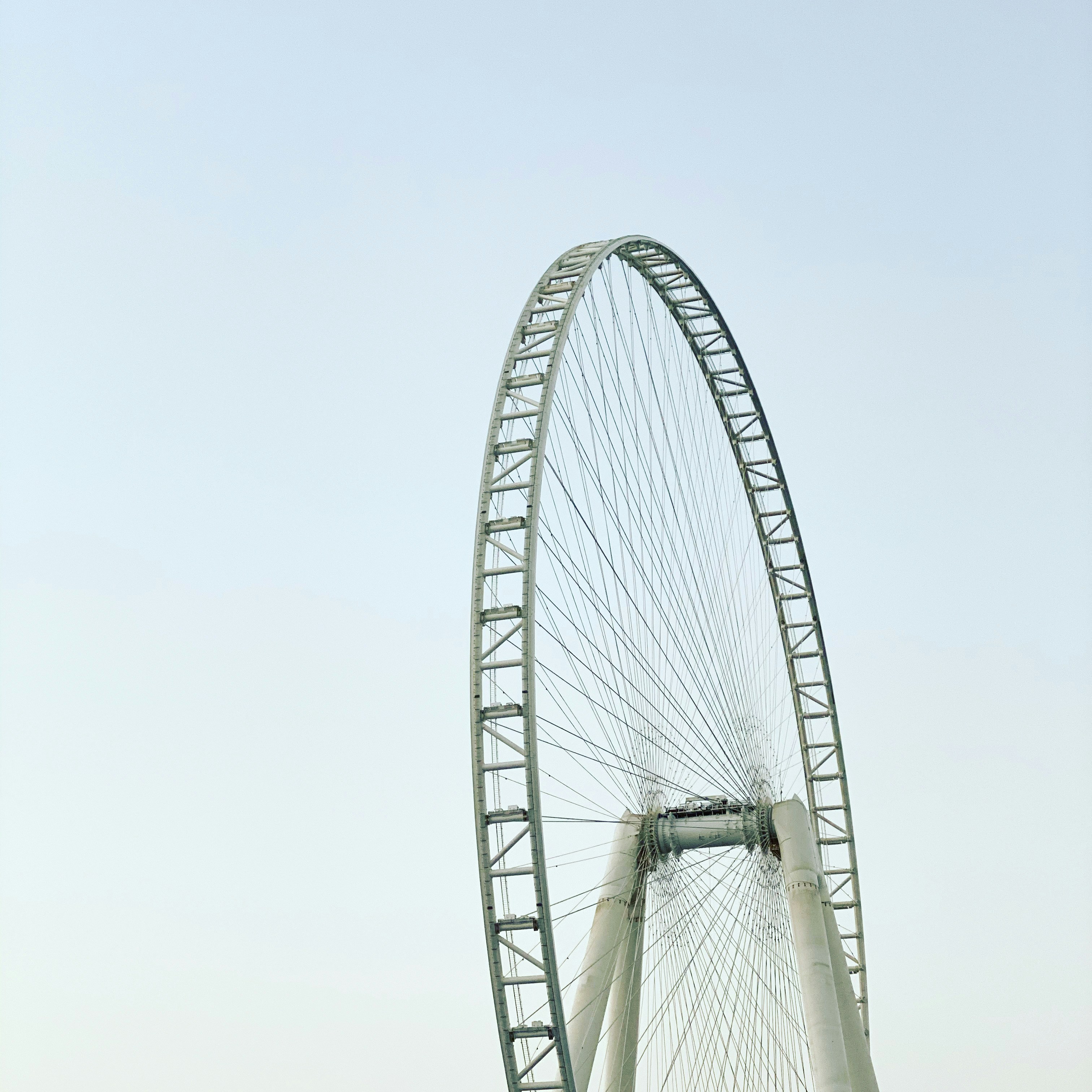 Arrow of the Sky: A Ferris Wheel Reaches for Morning Light