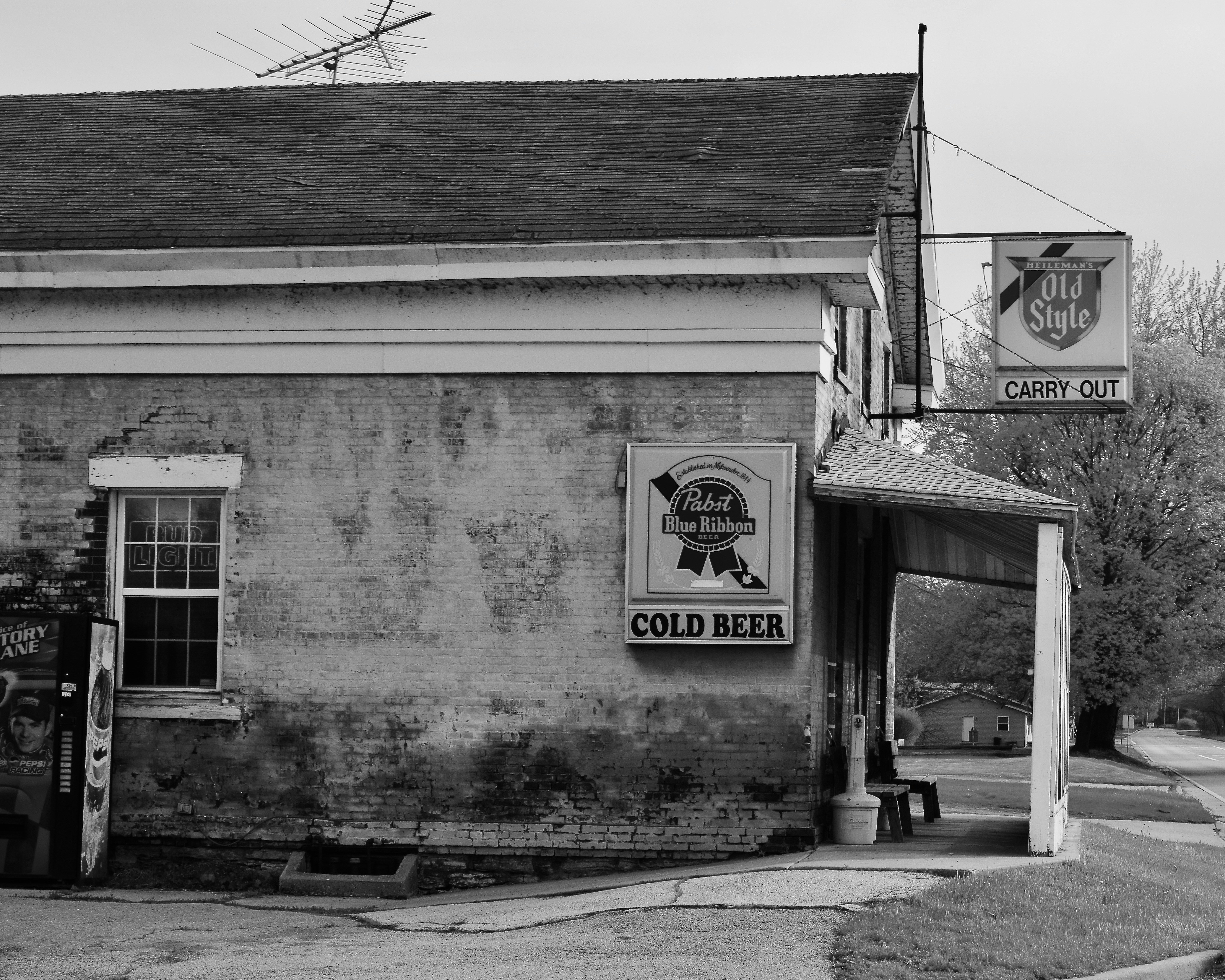 Weathered Corner Store: Cold Beer Sign Under a Sloped Roof