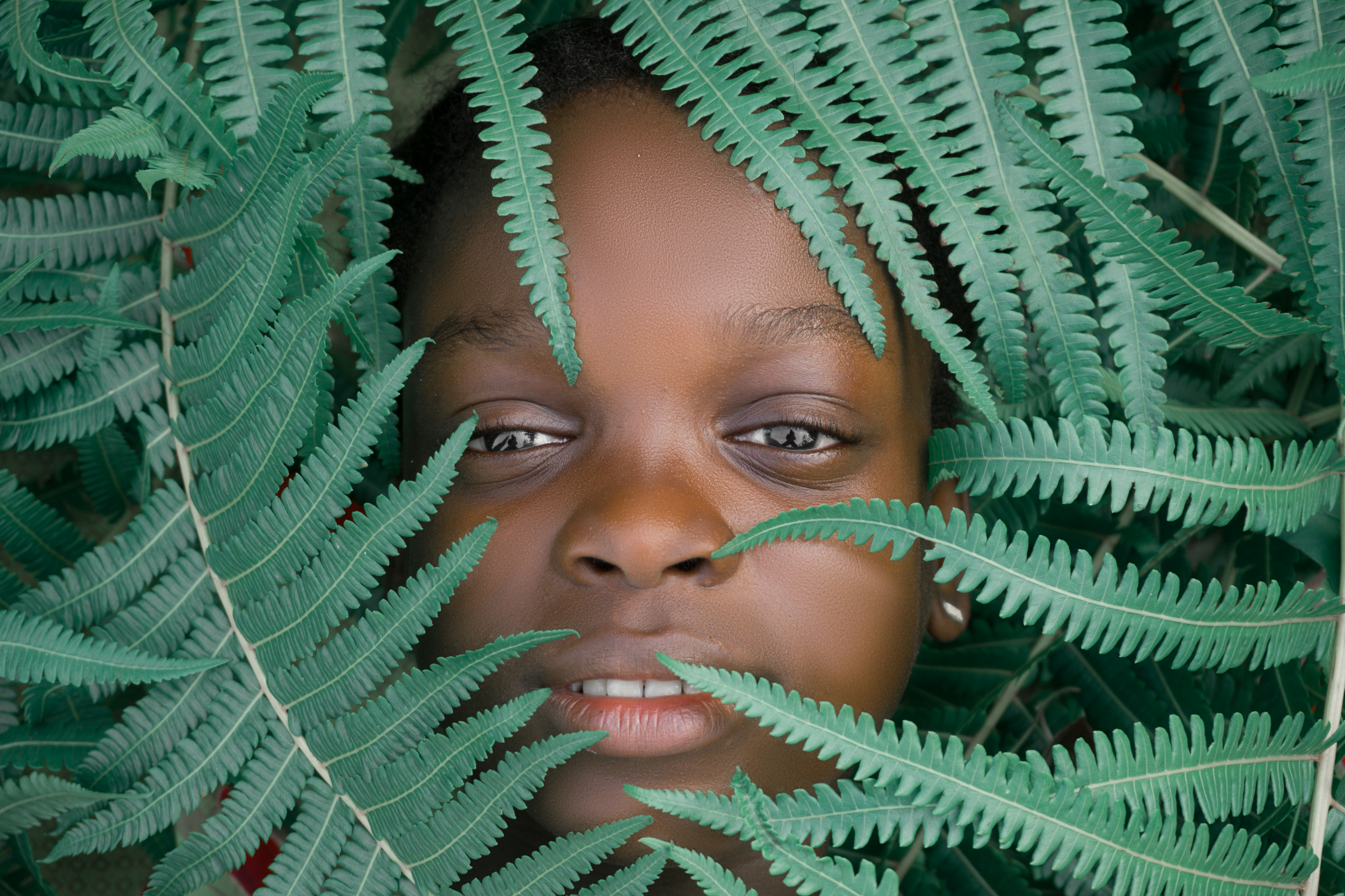 Emerald Veil: A Child's Calm Recedes into Foliage
