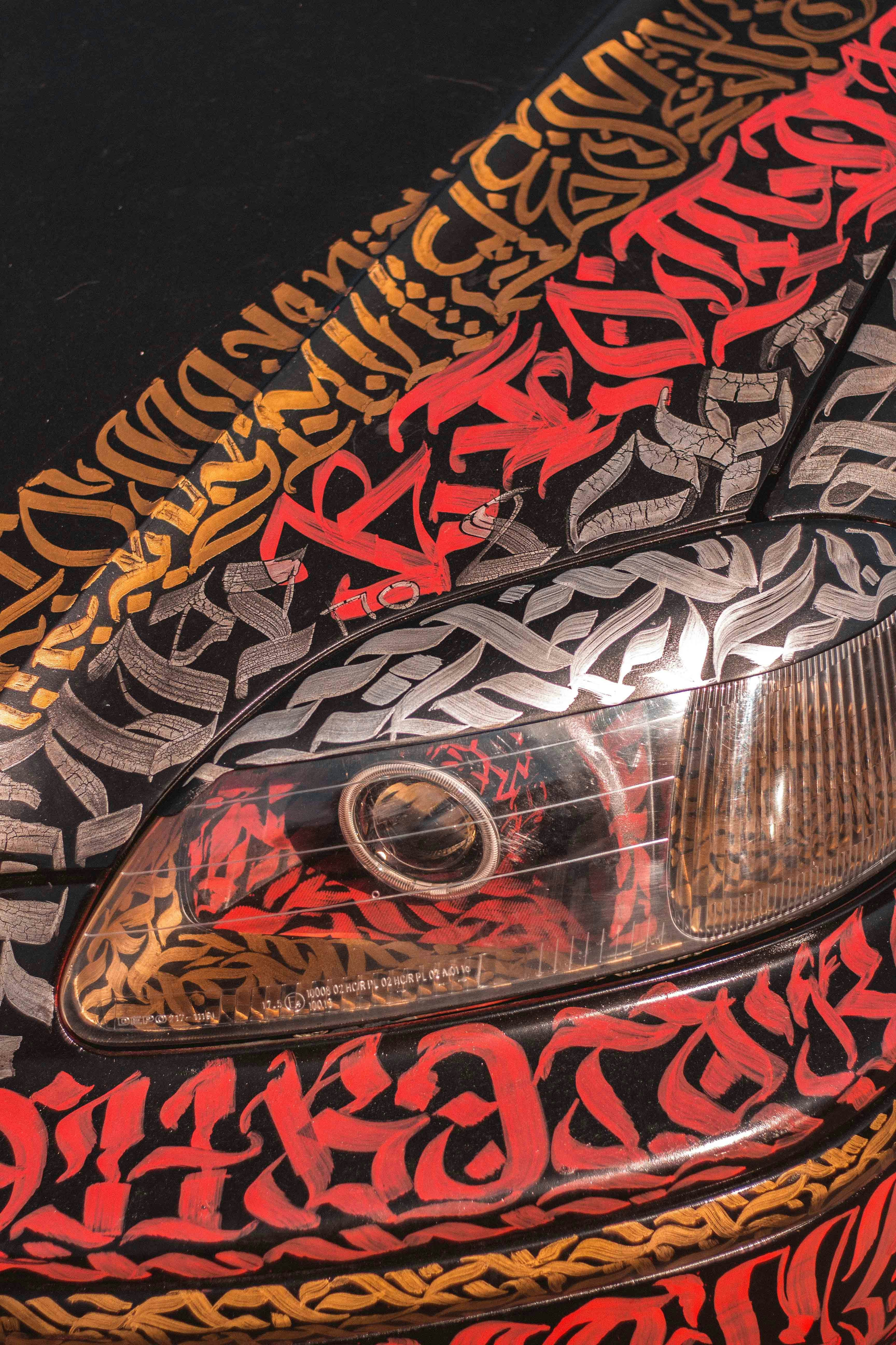 Graffiti-etched headlights: a tribal wrap on a sports car