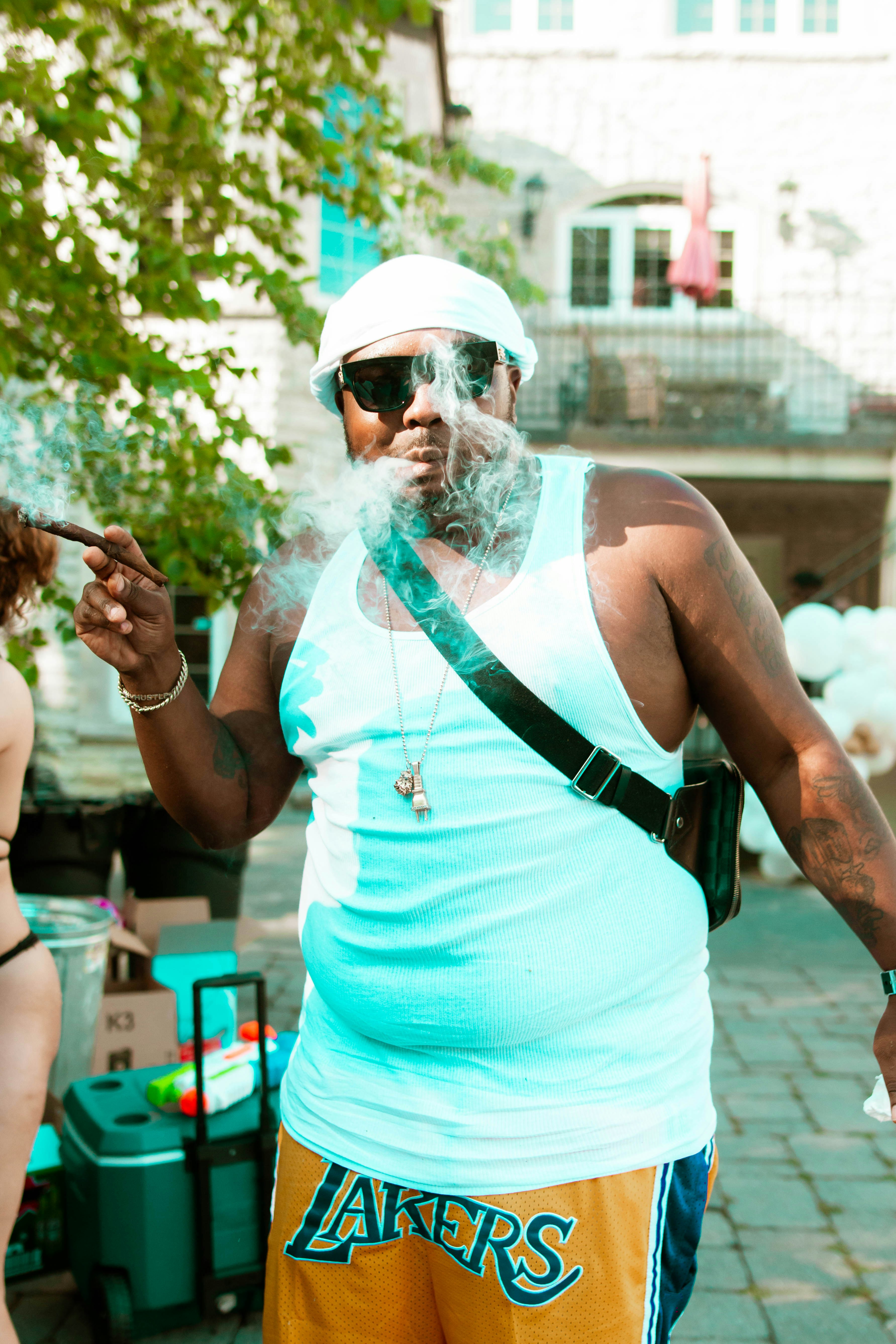 Cigar smoke and summer swagger: a sunlit street portrait