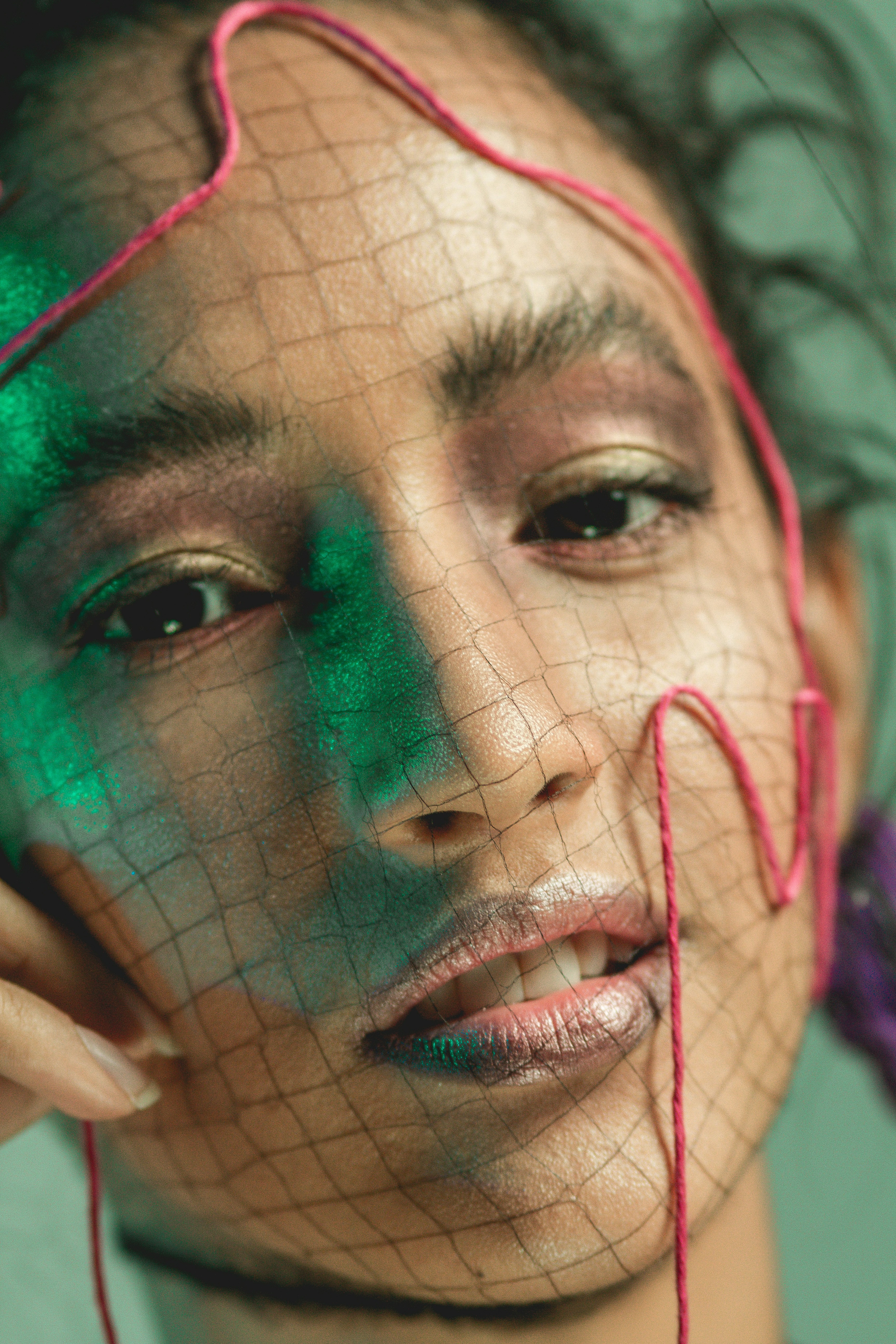 Woman with green and red face paint photo – Free Beauty Image on Unsplash