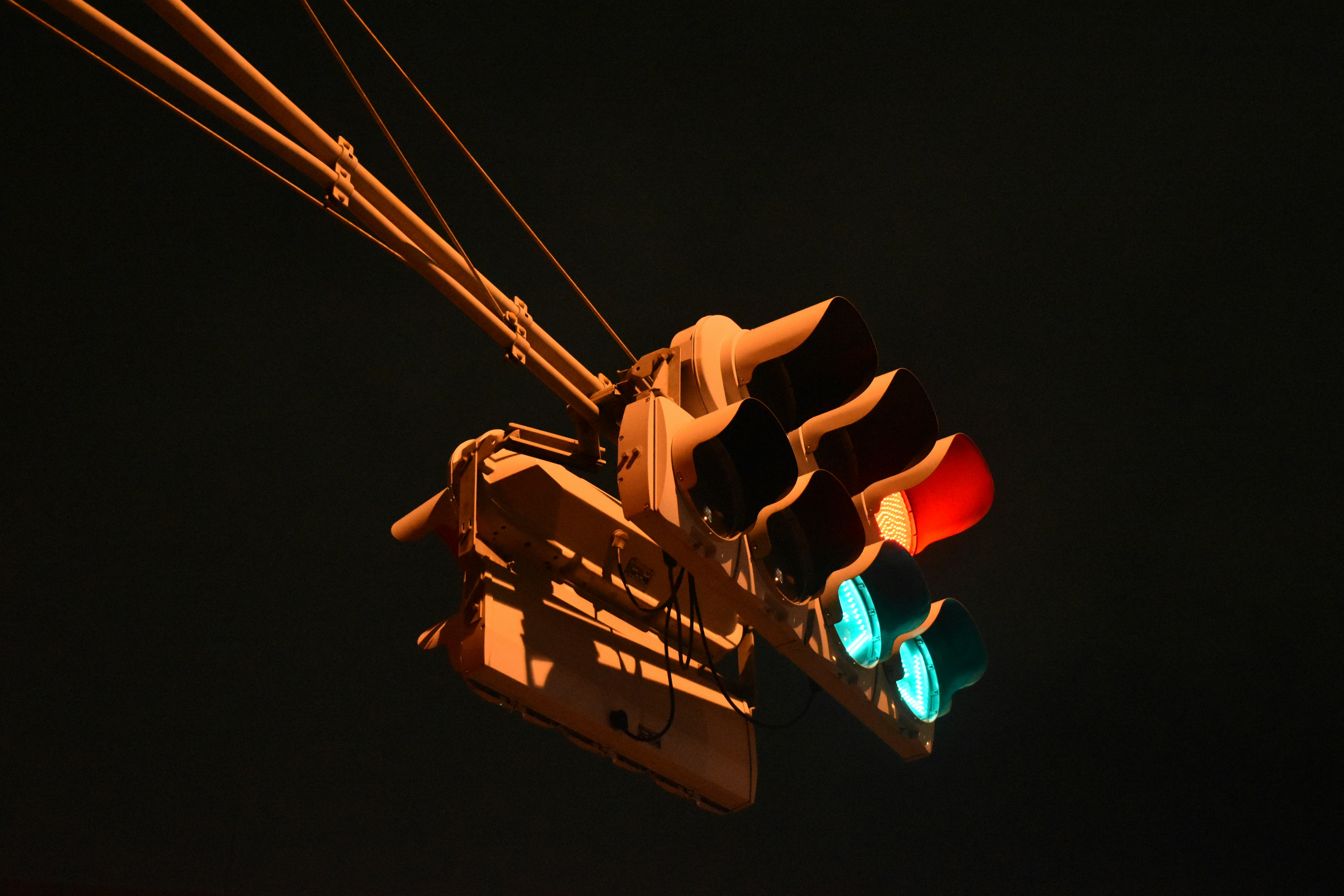 Midnight Signal: Ember-Orange Traffic Light Against a Velvet Night