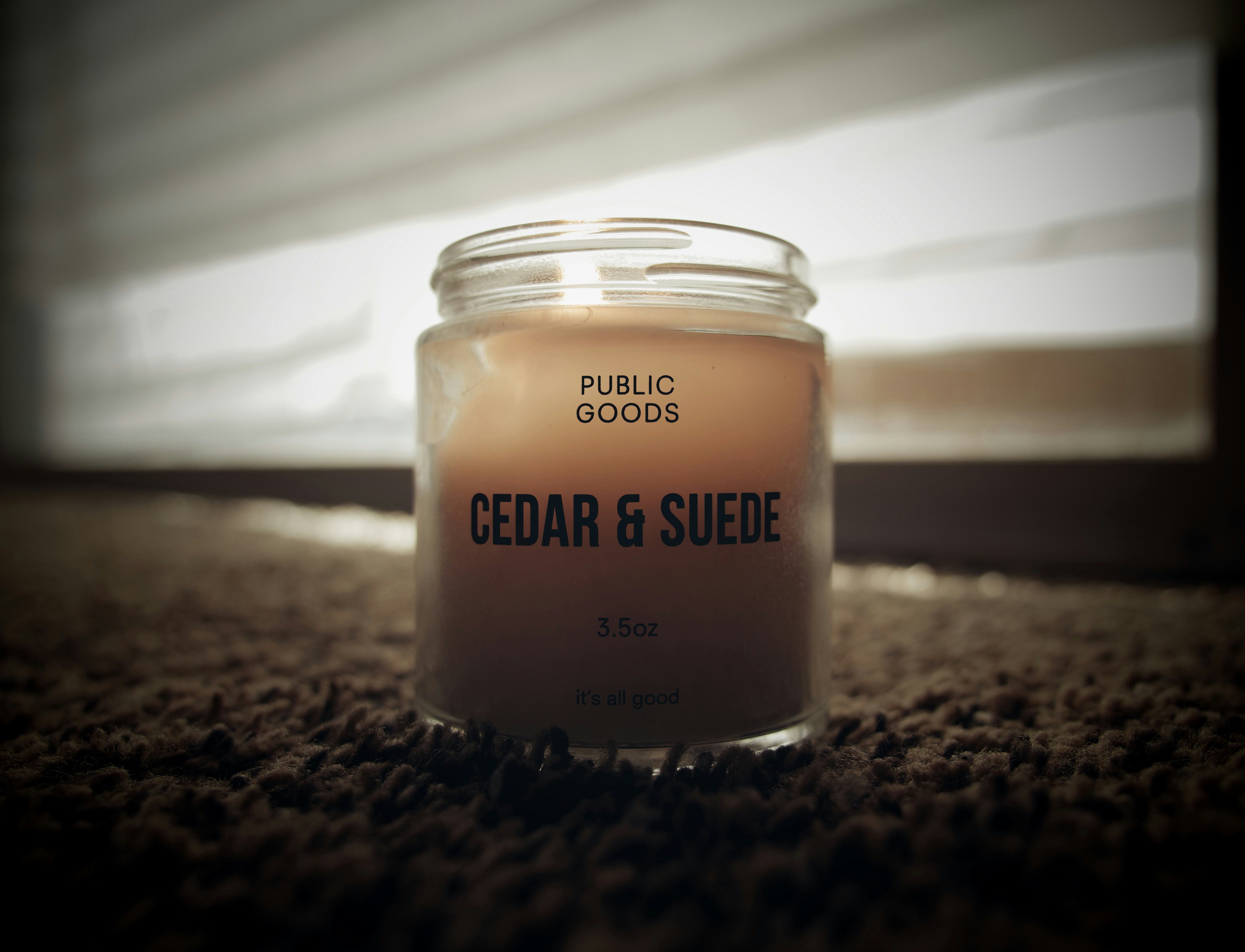 Cedar & Suede Candle: Gentle Glow on a Textured Stage