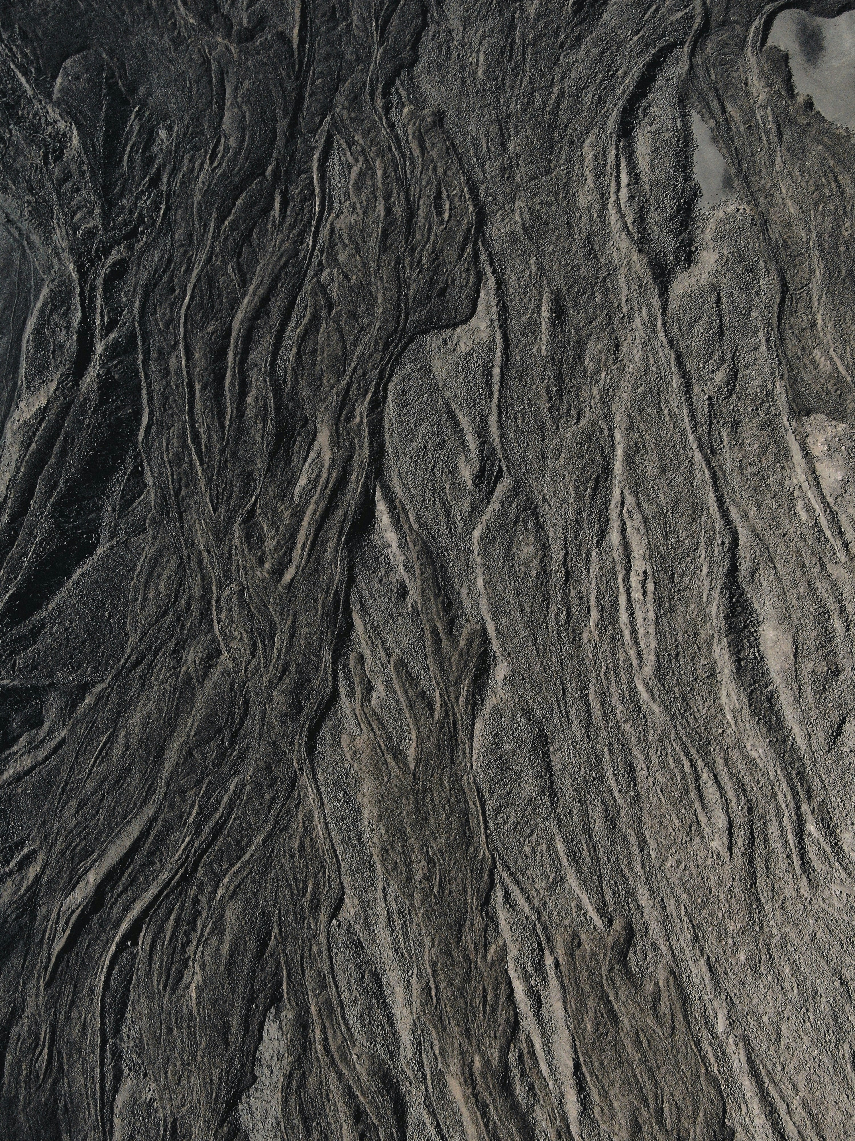 These lava flows have more than 100 years, and if you can fly above, you can see their majestic history behind. It's such a rad moment to be alive my folks | brown and black rock formation