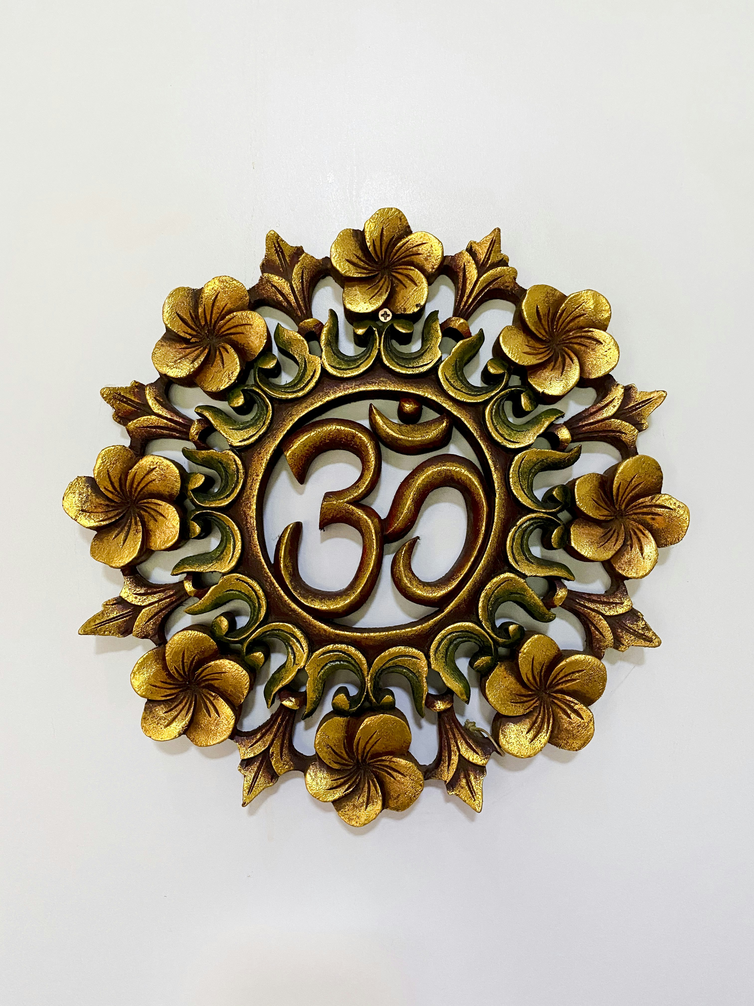 Om in a Floral Crown: A Golden Mandala Framed by Ornate Petals