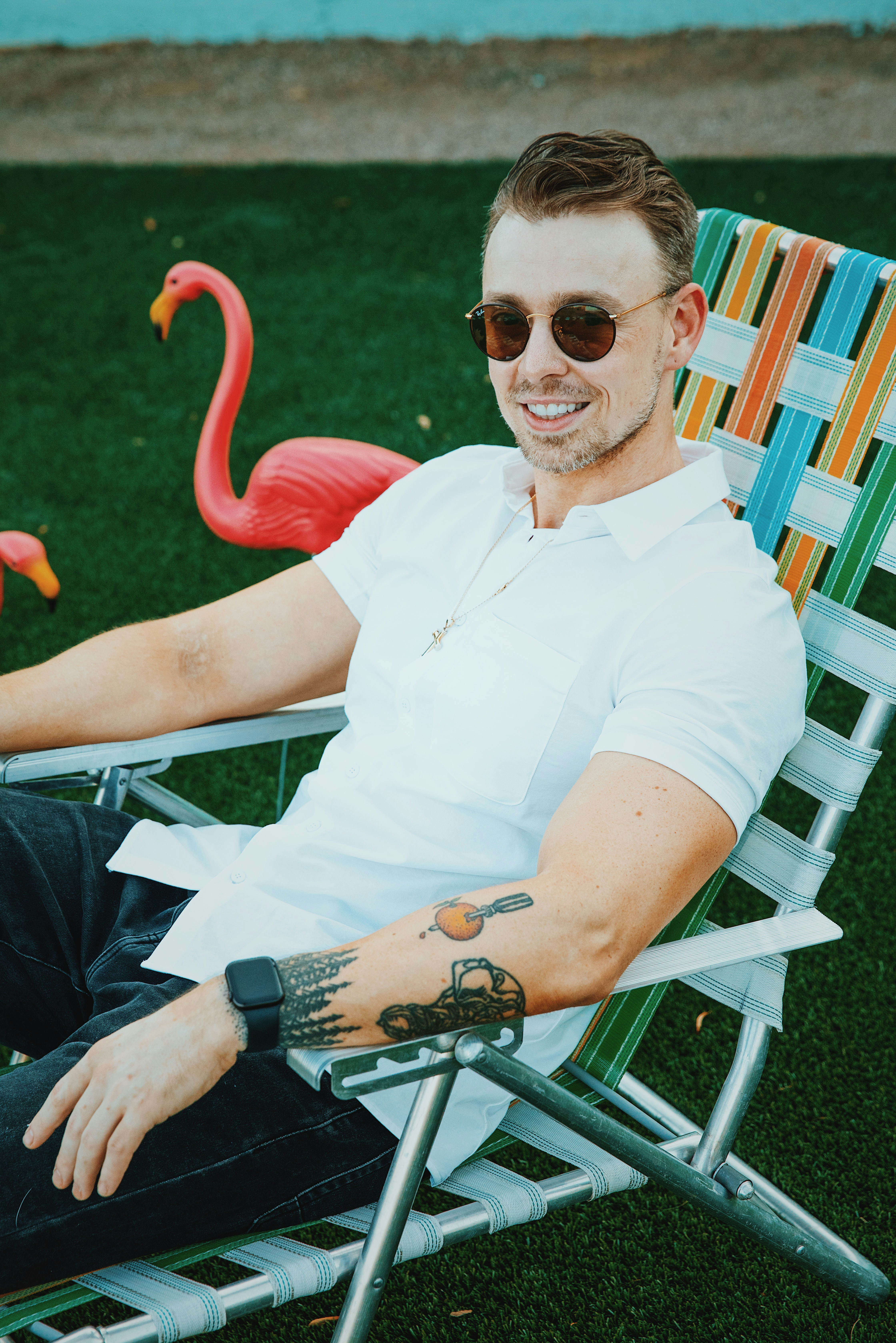Sunlit Confidence: Flamingo Backdrop and Striped Lounge
