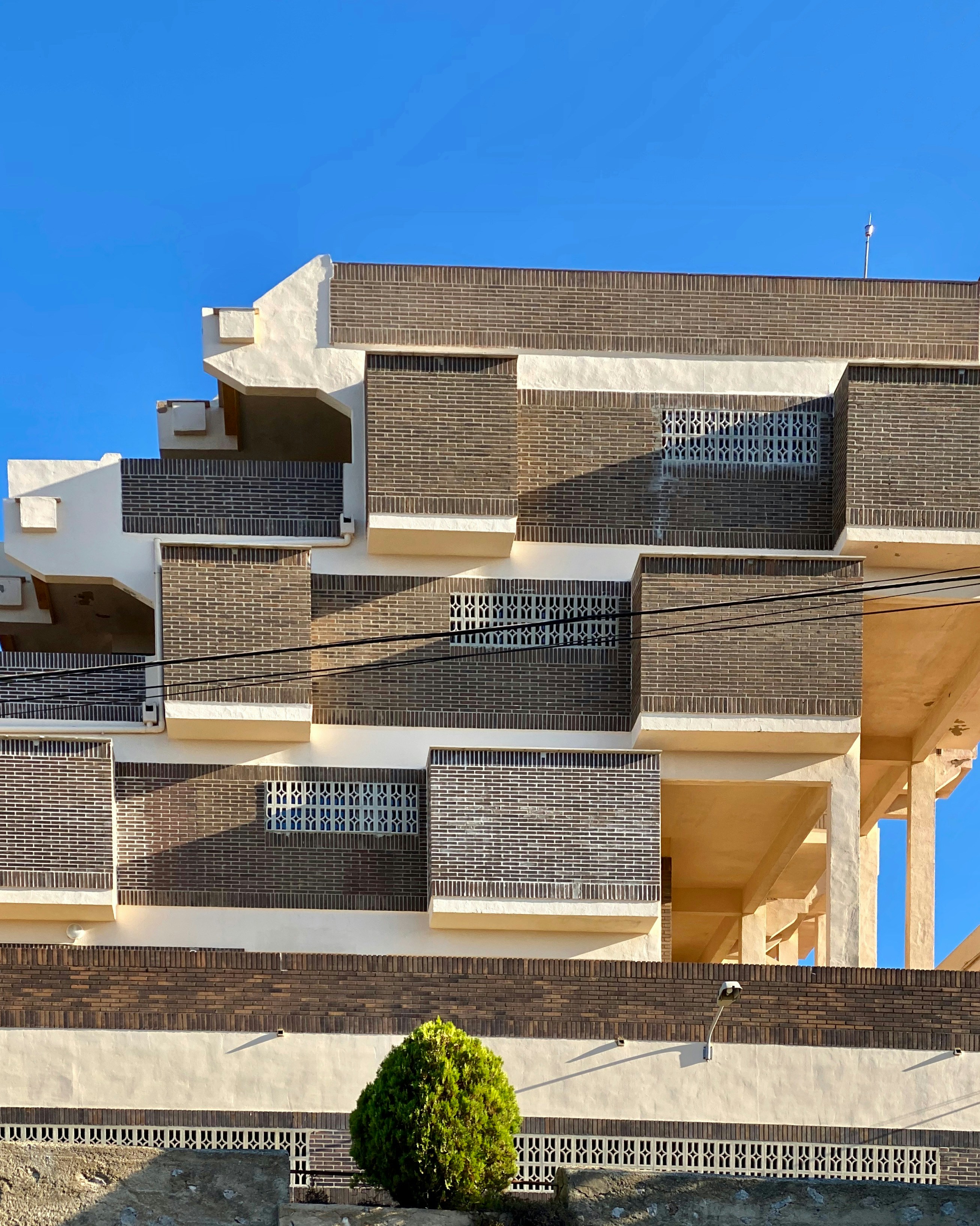 Terraced Brick Geometry Under a Cerulean Sky