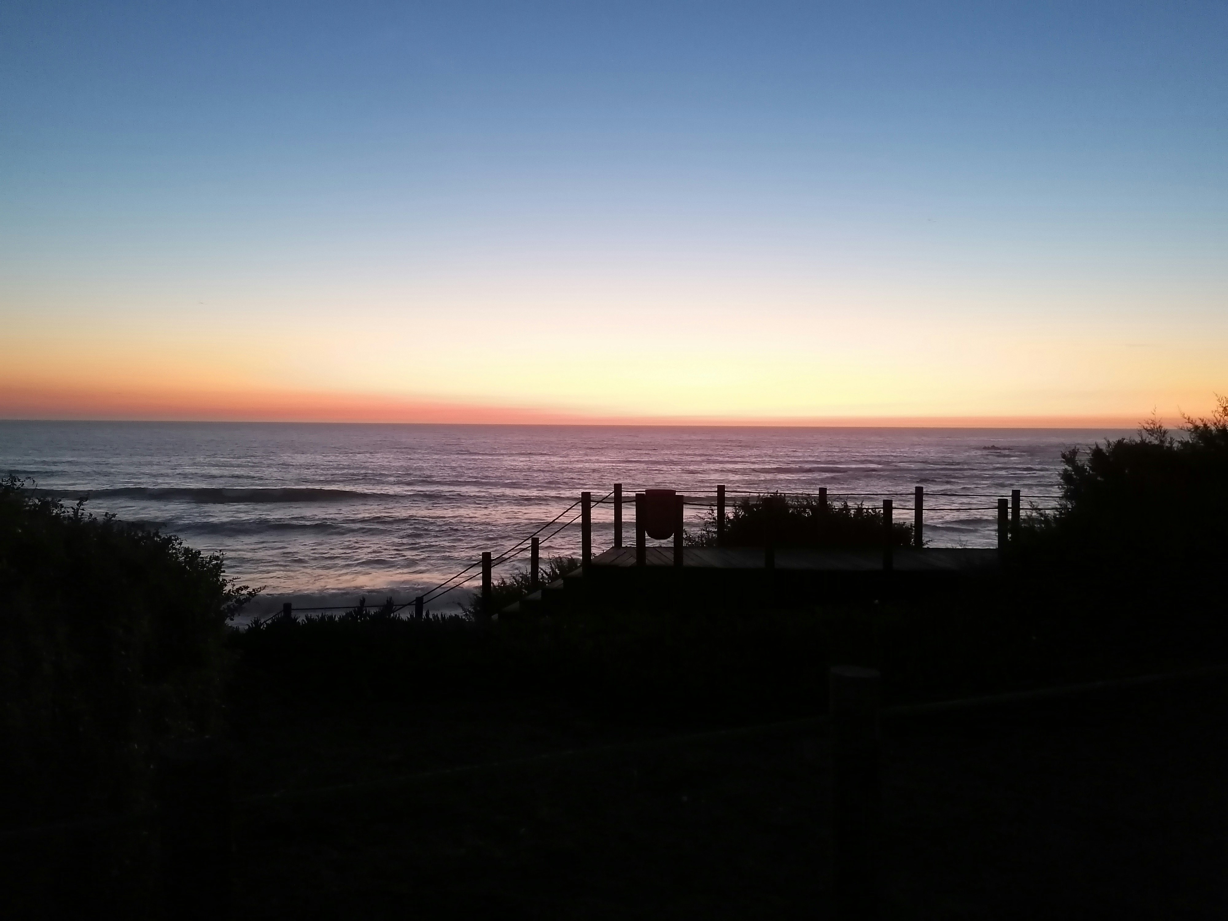 Twilight Tranquility Over Ocean Waves