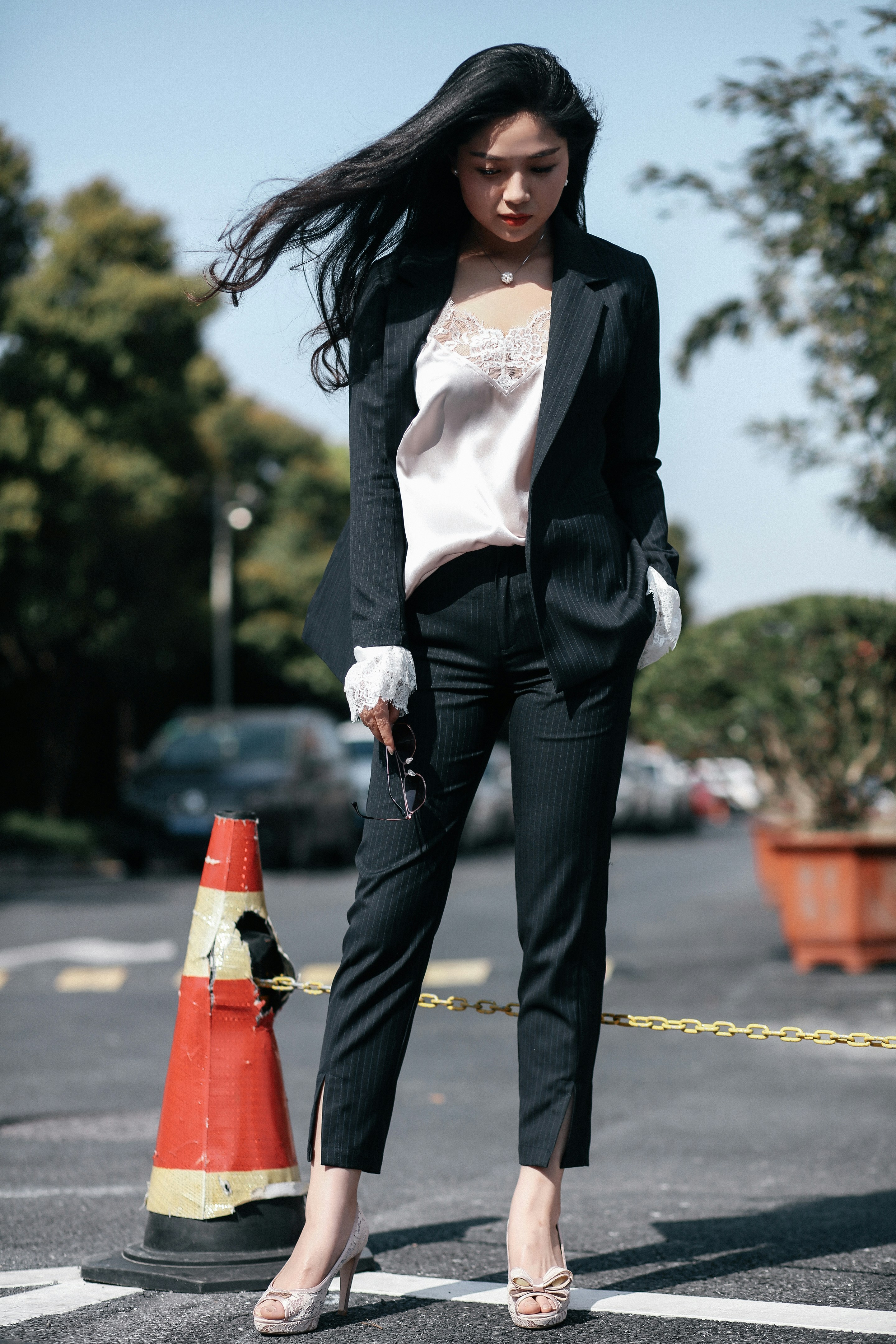 Power Suit in Focus: A Stylish Walk Posture Amid Urban Quiet