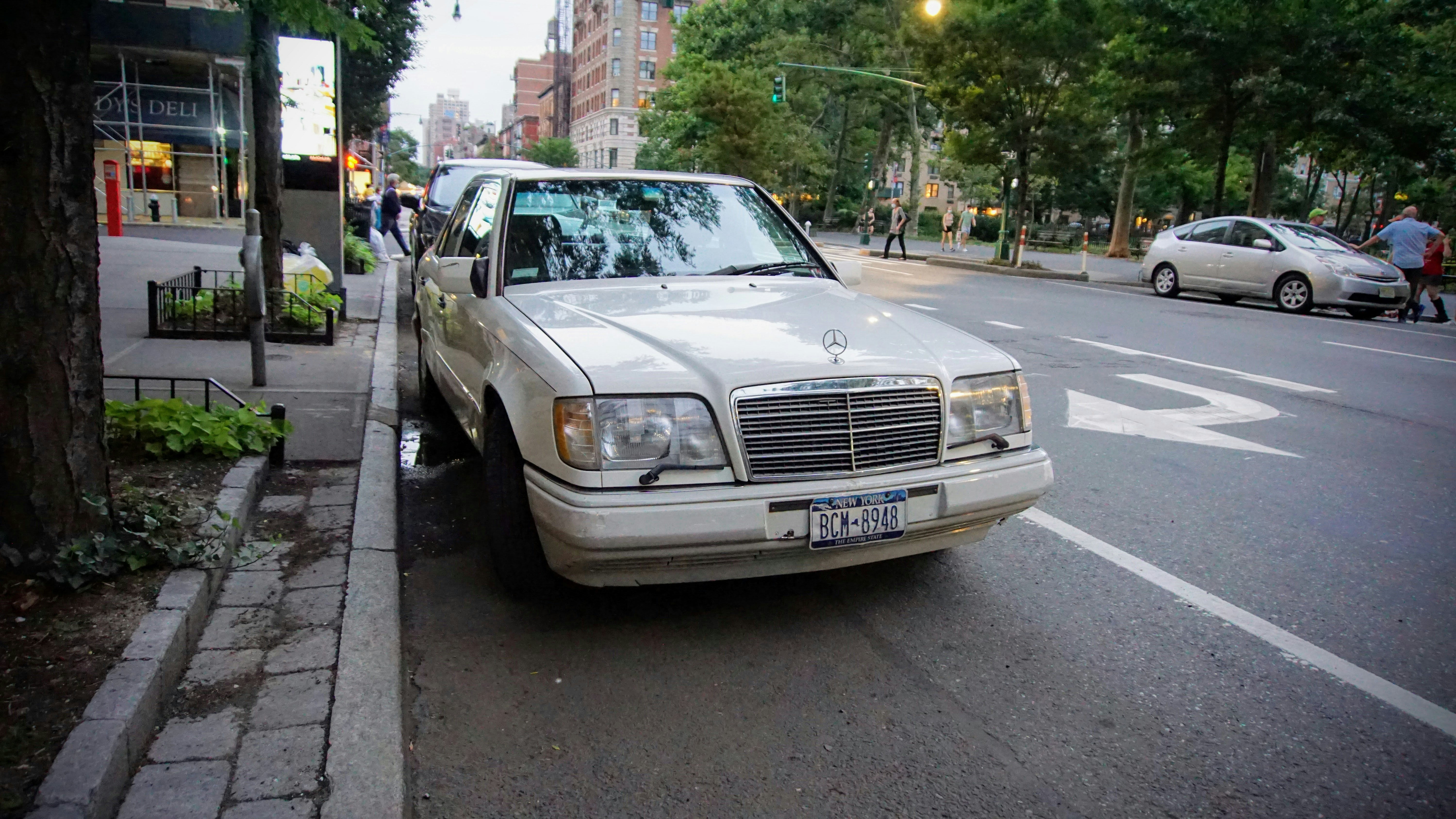 Curbside Relic: A Mercedes Taxi Anchoring a Quiet City Street