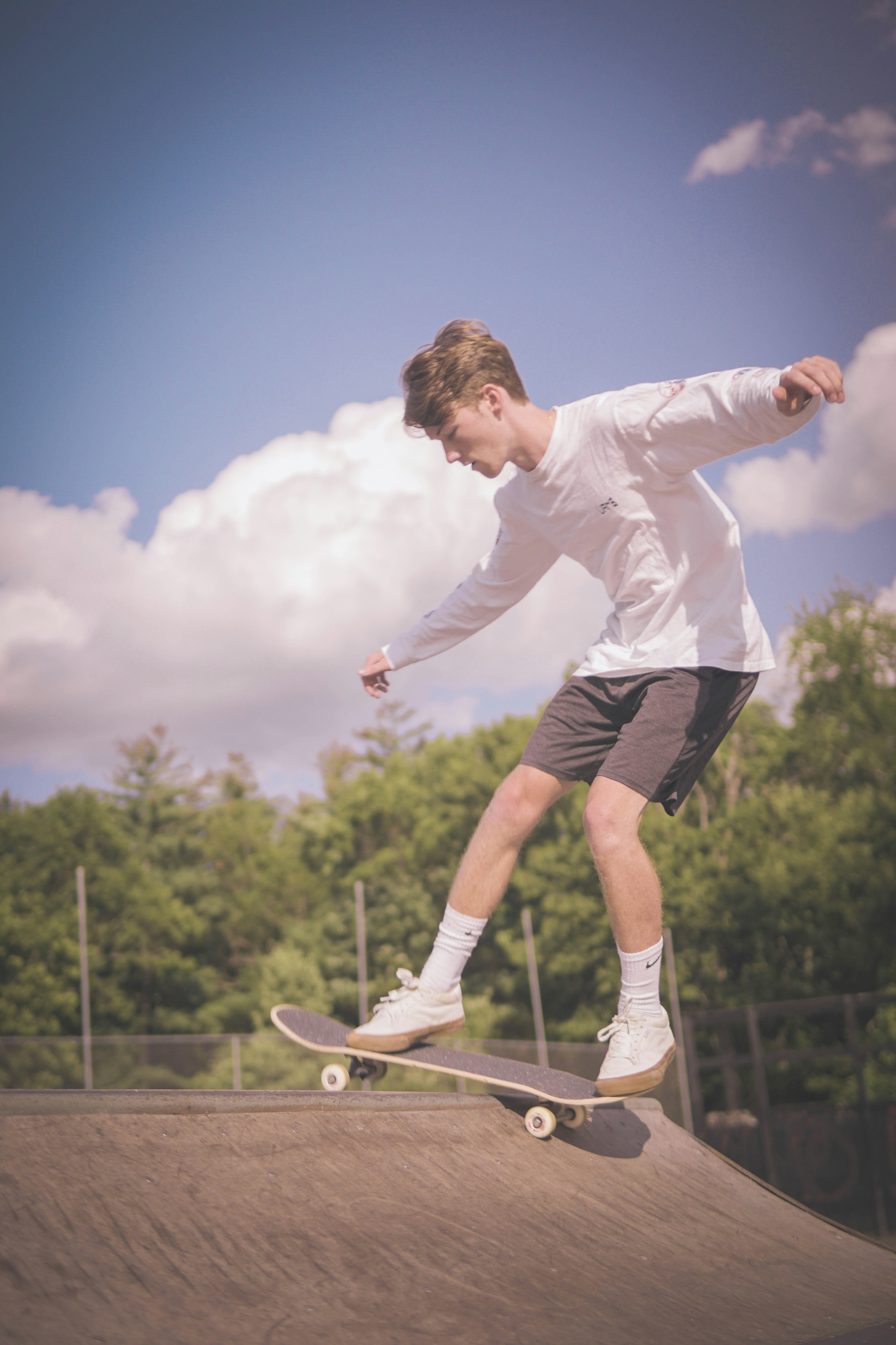 A man riding a skateboard on top of a ramp photo – Free Simsbury Image ...
