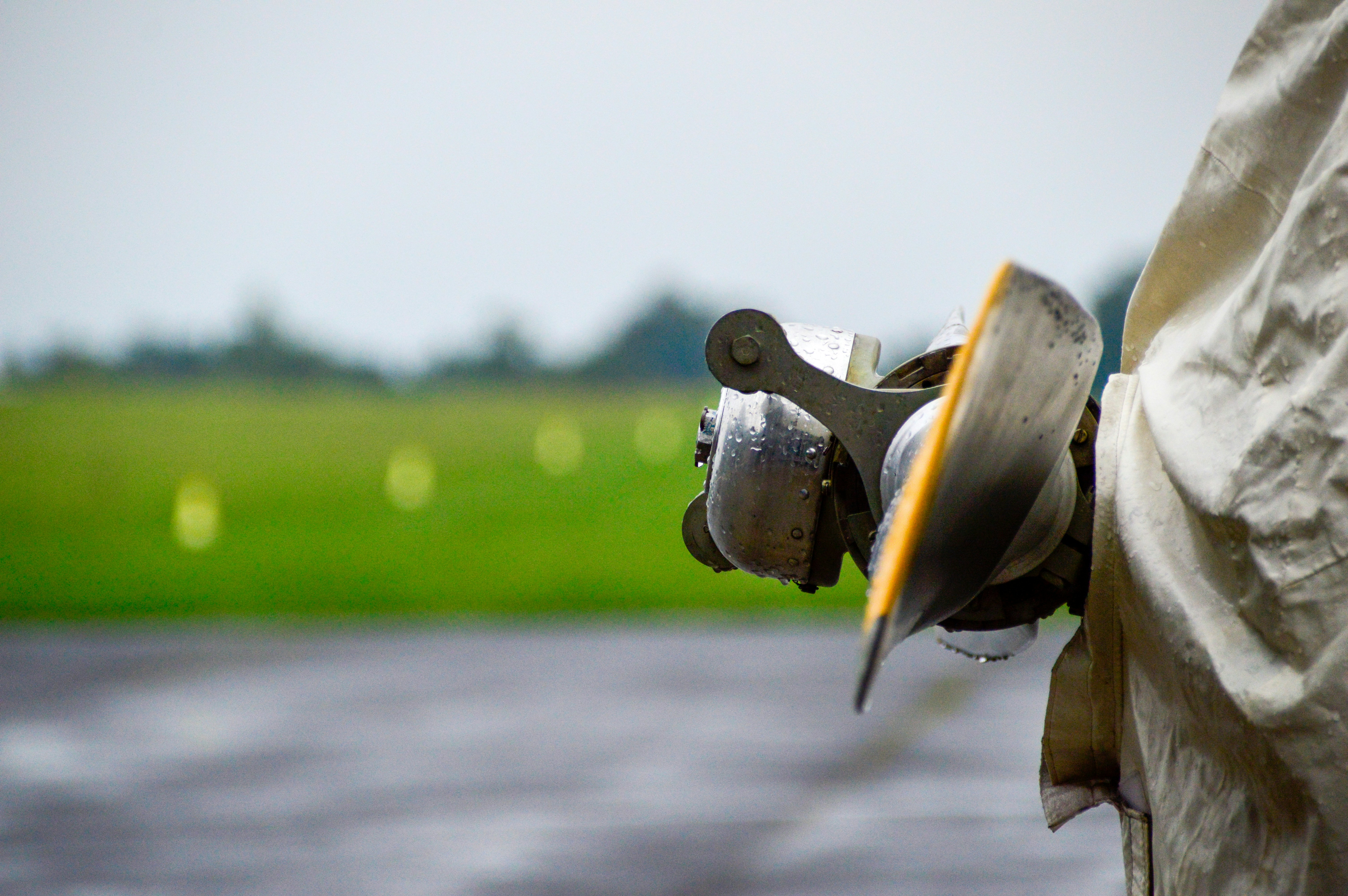 Gloved Grip on a Circular Saw Against a Blurred Field