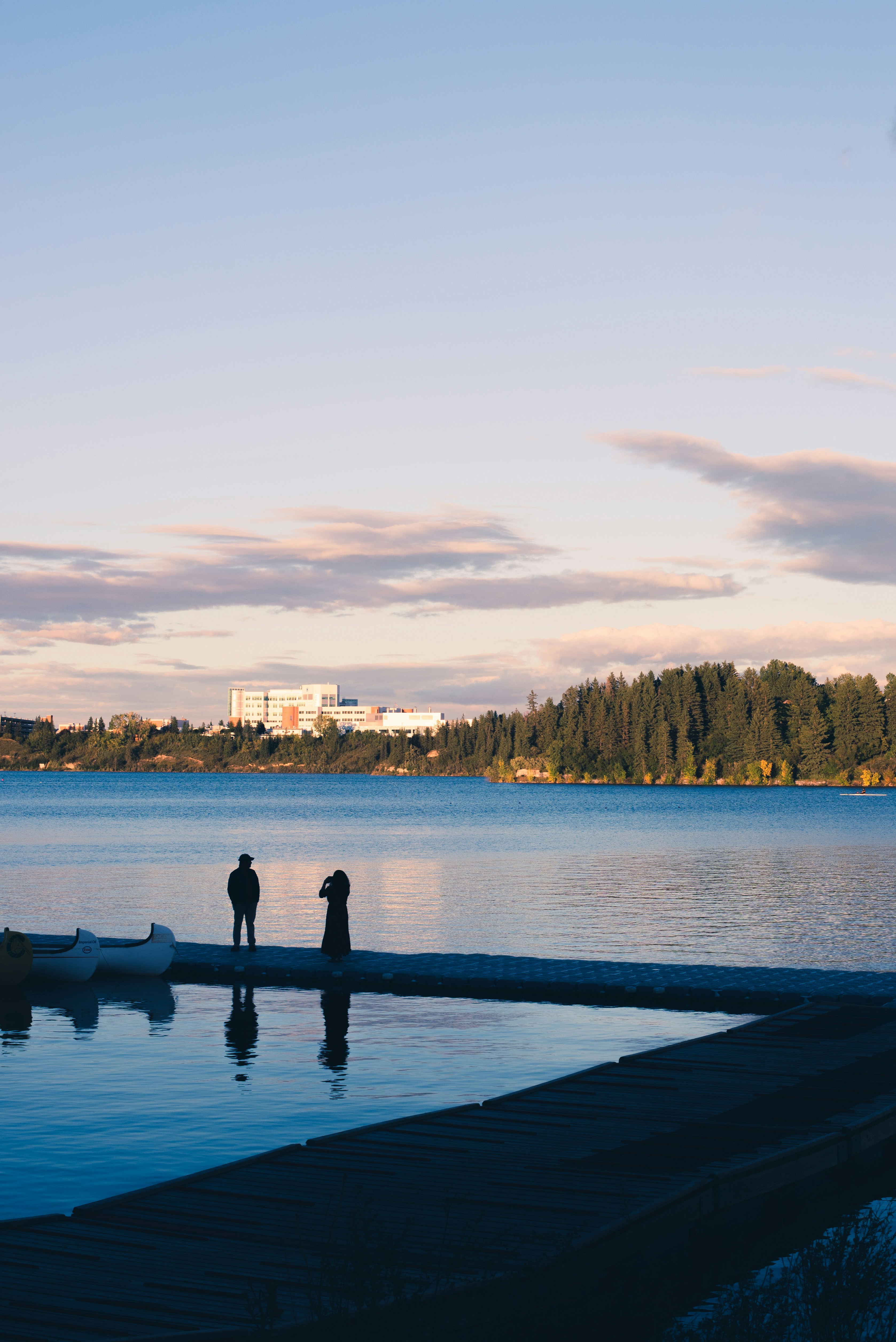 people standing on dock during daytime