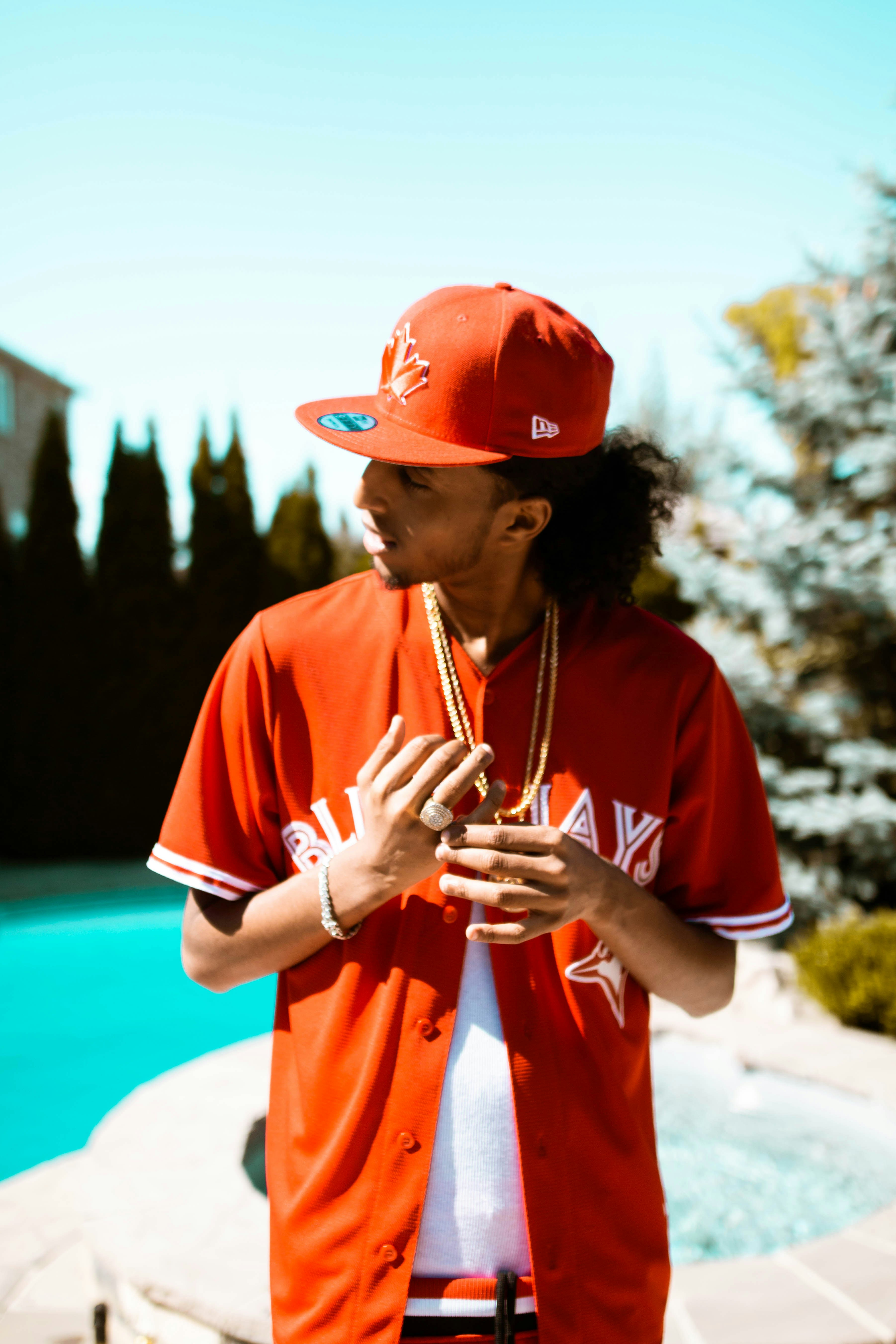 Poolside Pulse: Red Jersey Portrait in Sunlit Focus