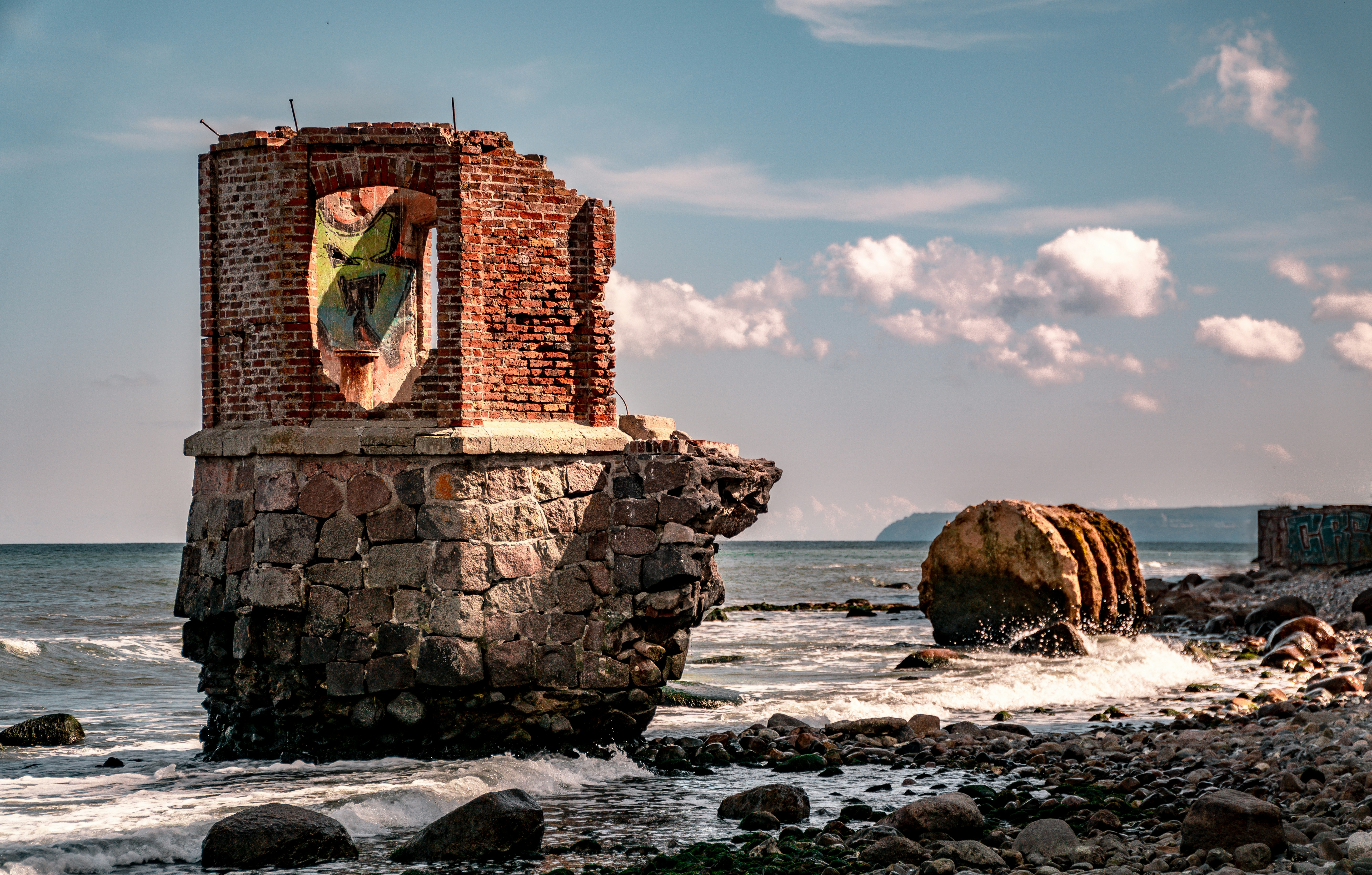 brown brick building on sea shore during daytime
