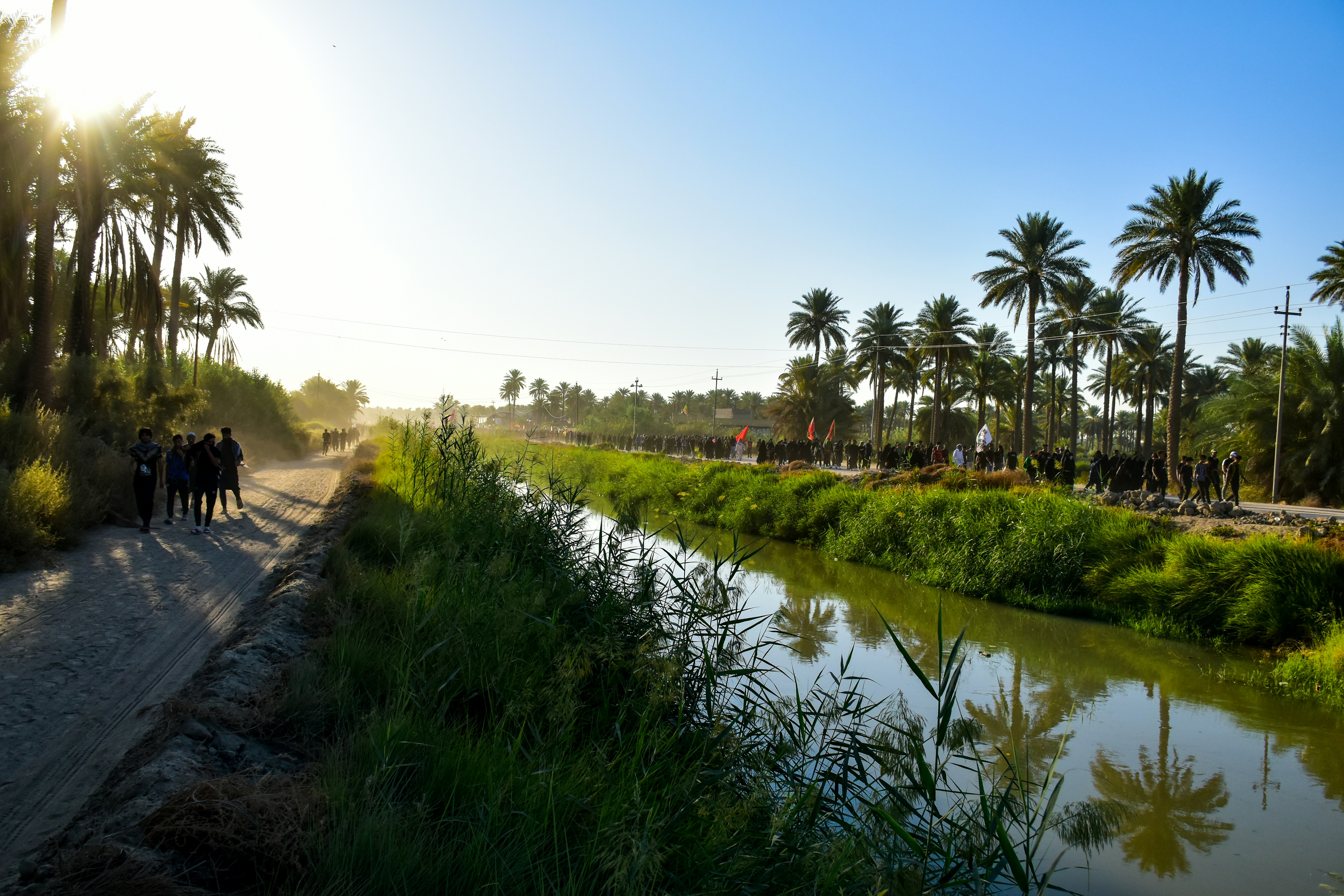 Green grass and trees near river during daytime photo – Free Iraq Image ...