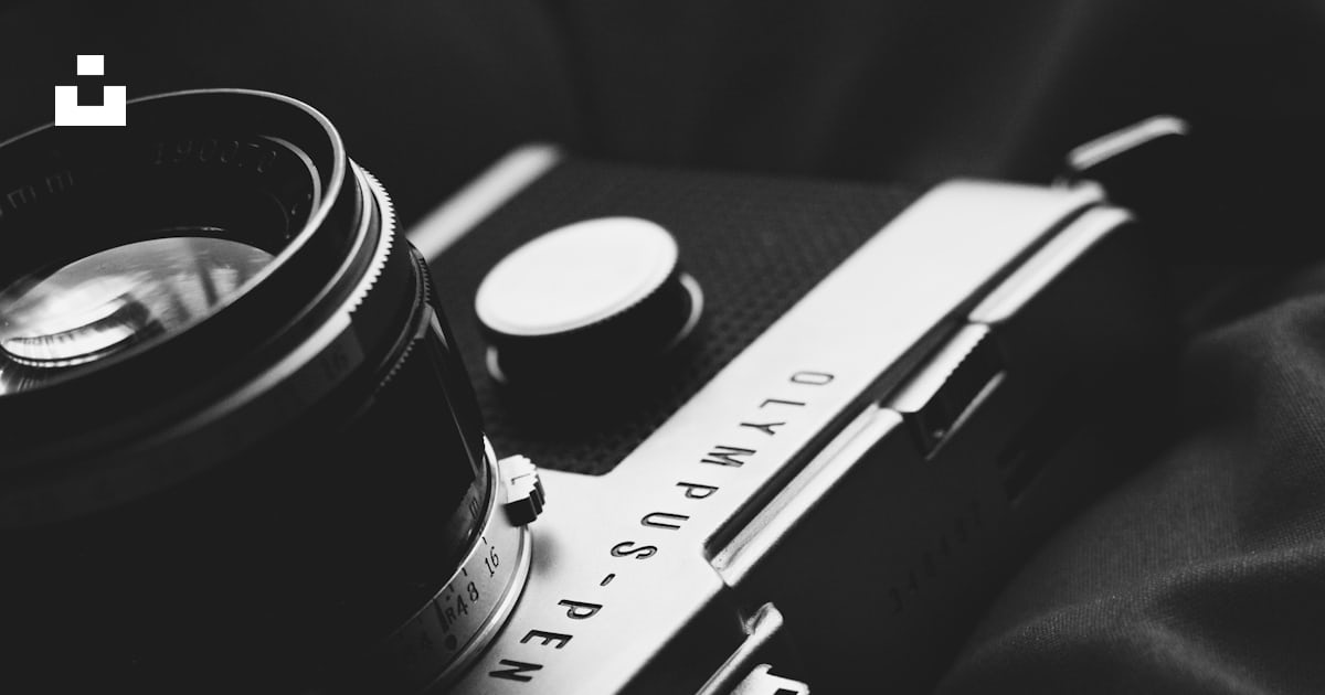 검은 섬유에 검은 색과 은색 Dslr 카메라 사진 Unsplash의 무료 올림푸스 이미지