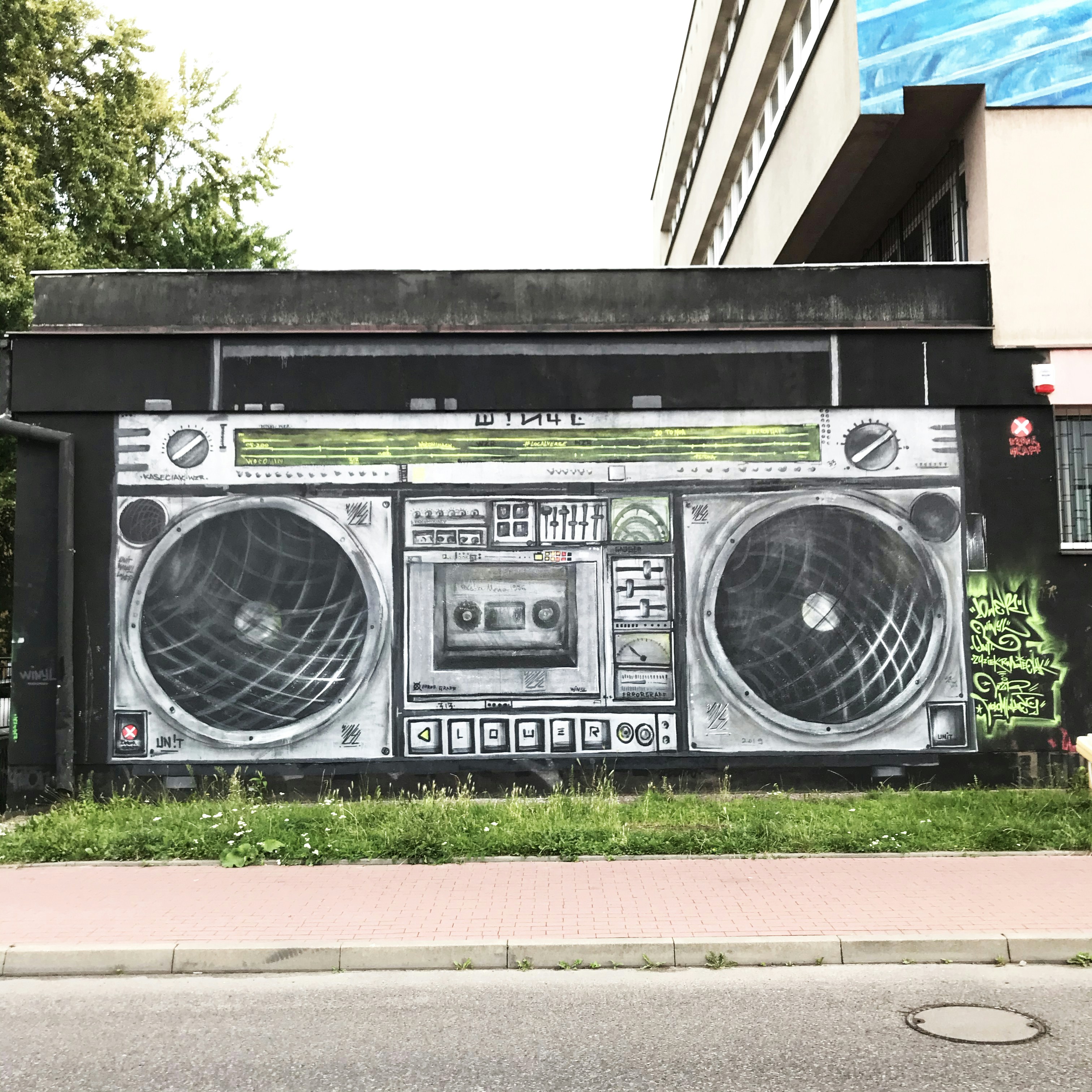 black and gray sony radio on gray concrete floor