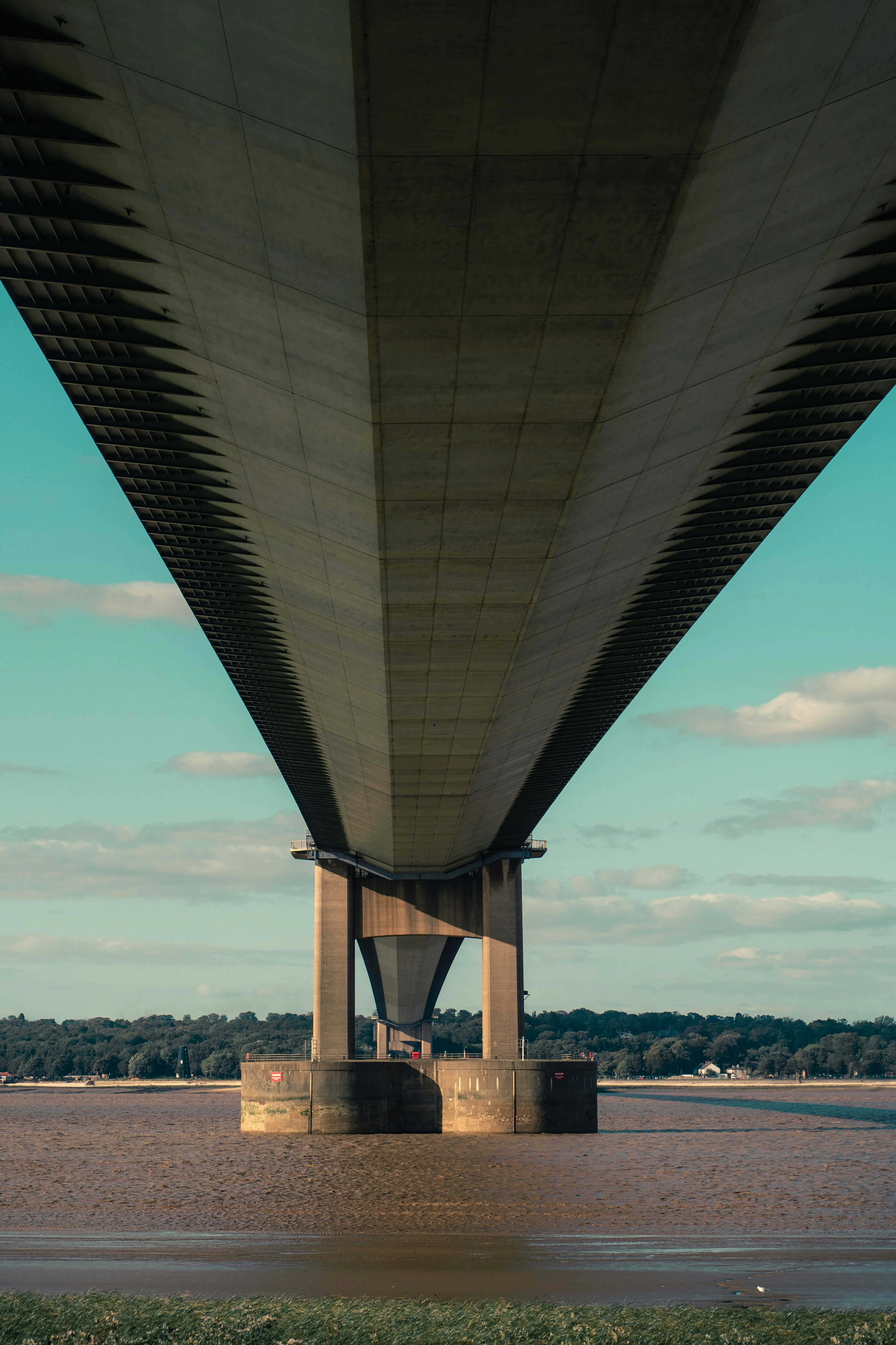 Gray concrete bridge over body of water during daytime photo – Free ...