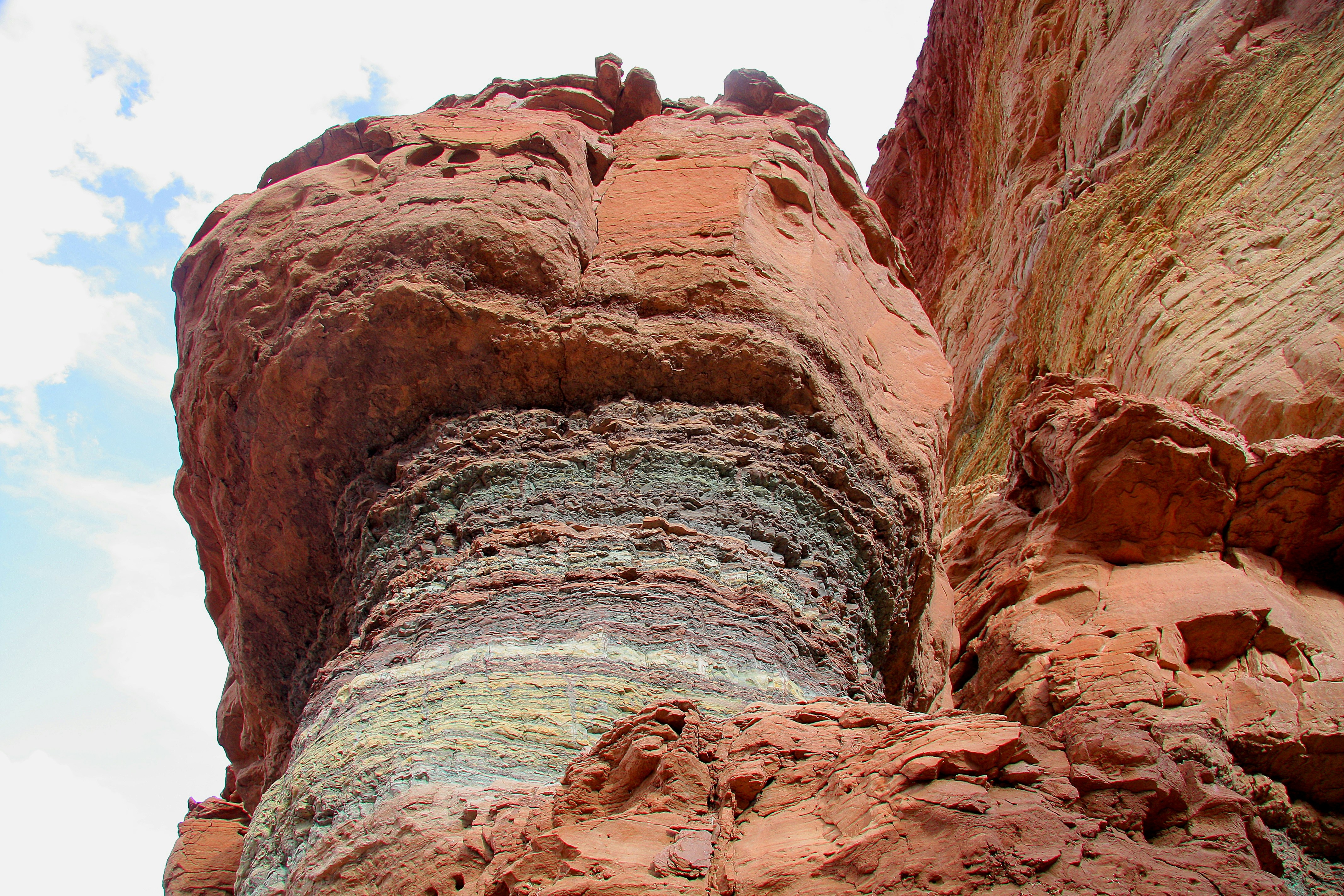 Rugged rock form seen on the road between Salta and Cafayate | brown rock formation under blue sky during daytime