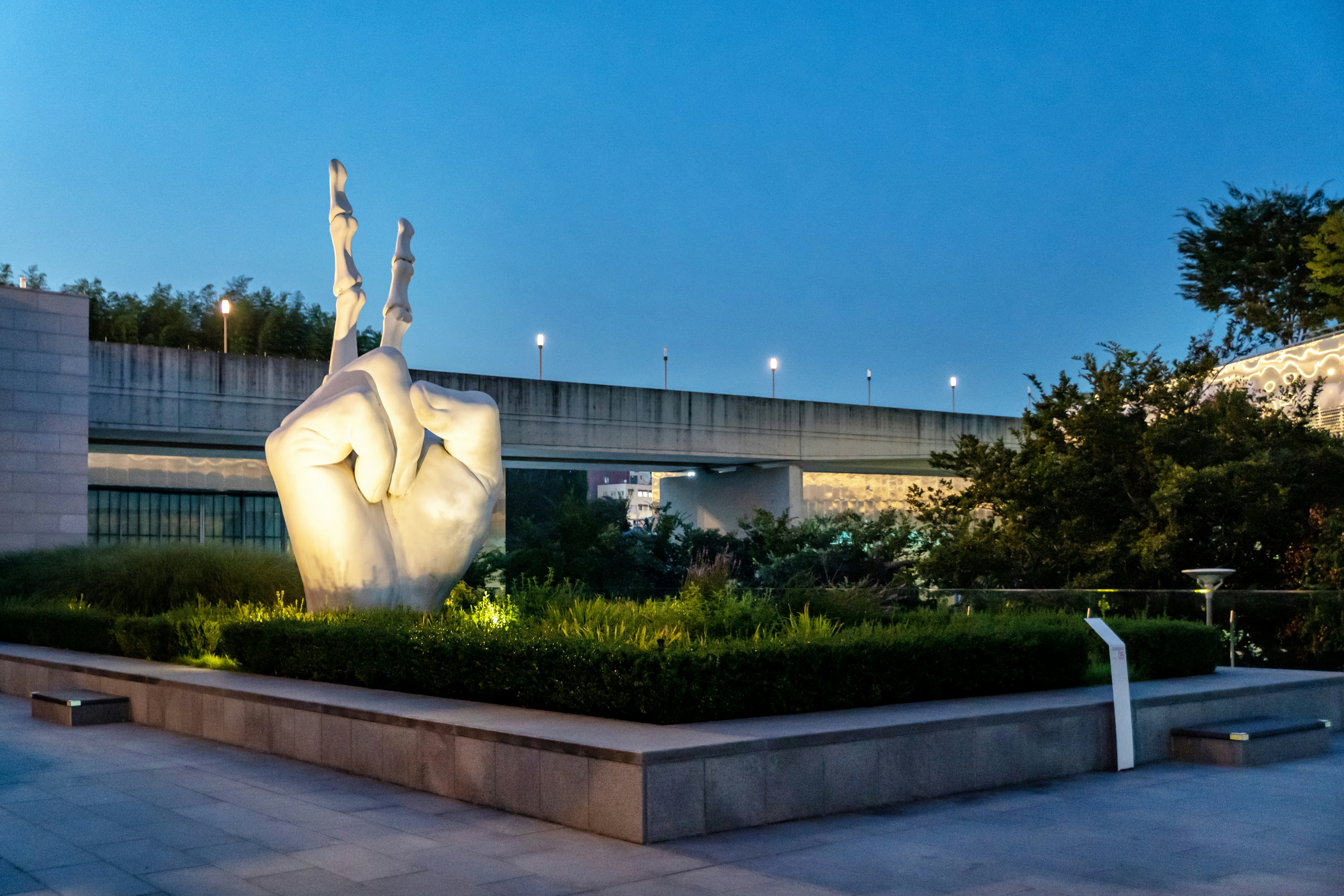 Blue Hour Monument: A Giant Hand Rises Over the Park Plaza