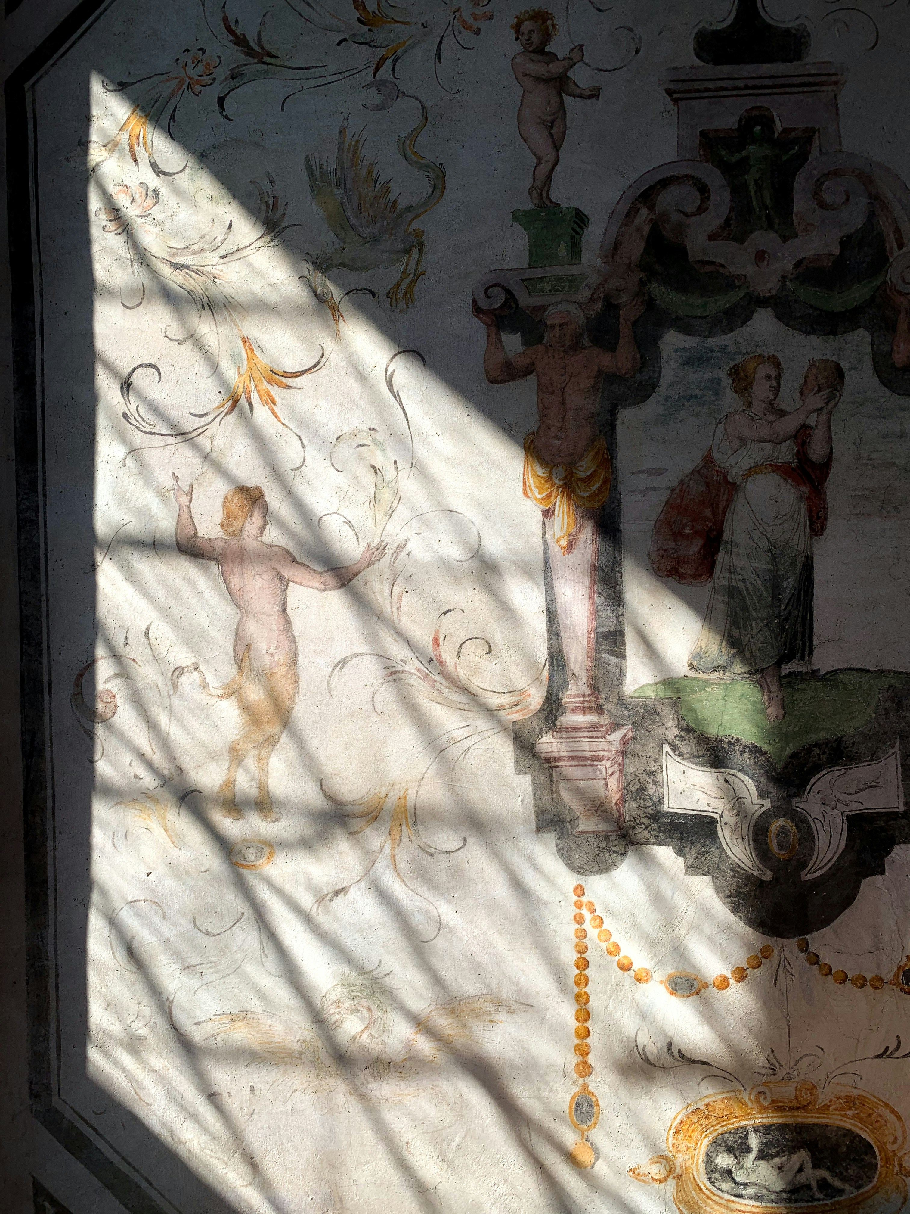 Sunlit Fresco Shadow: Diagonal Light Across a Historic Wall