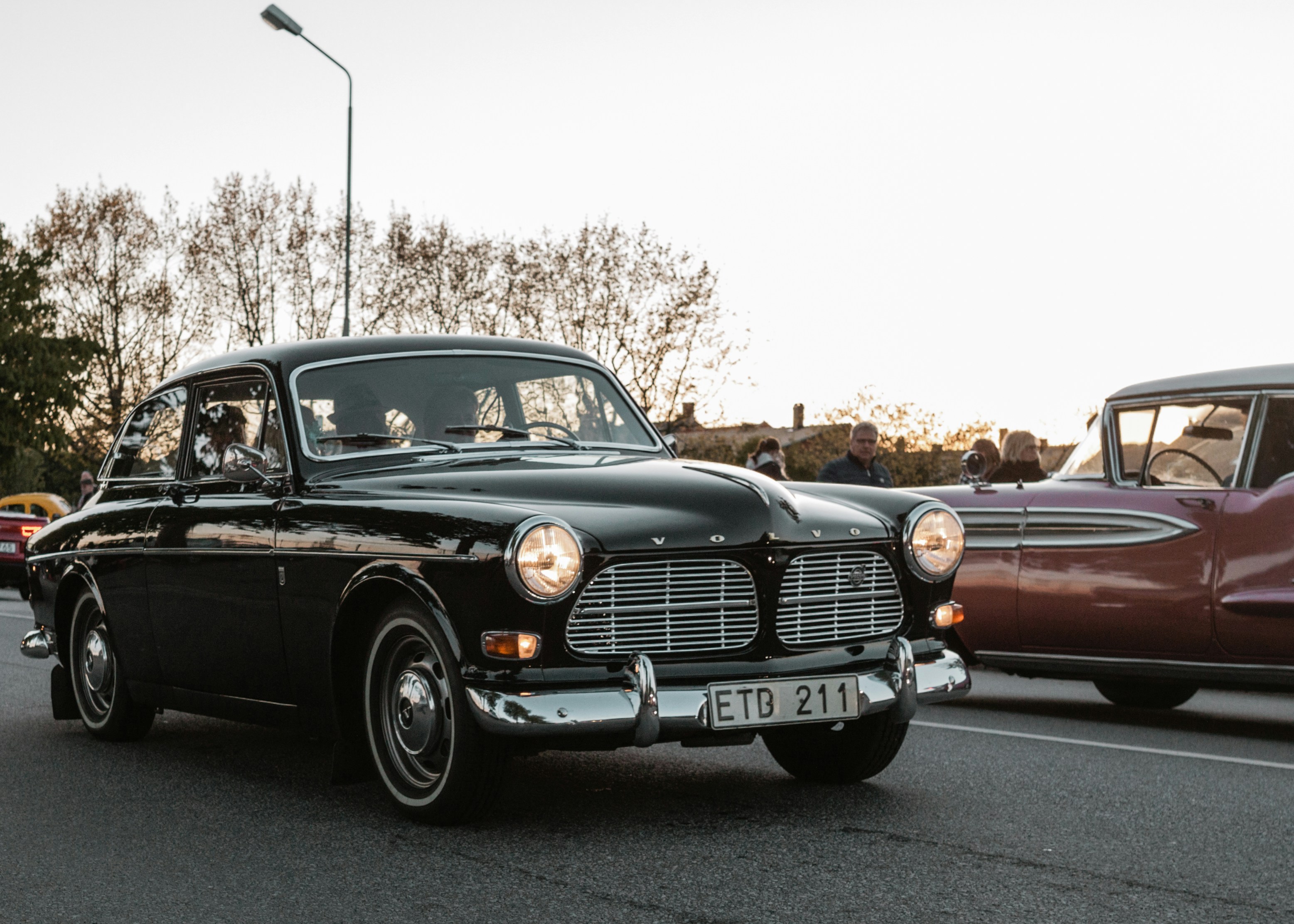 Midnight Classic: A Vintage Volvo Gracing the Street with sunset Backdrop