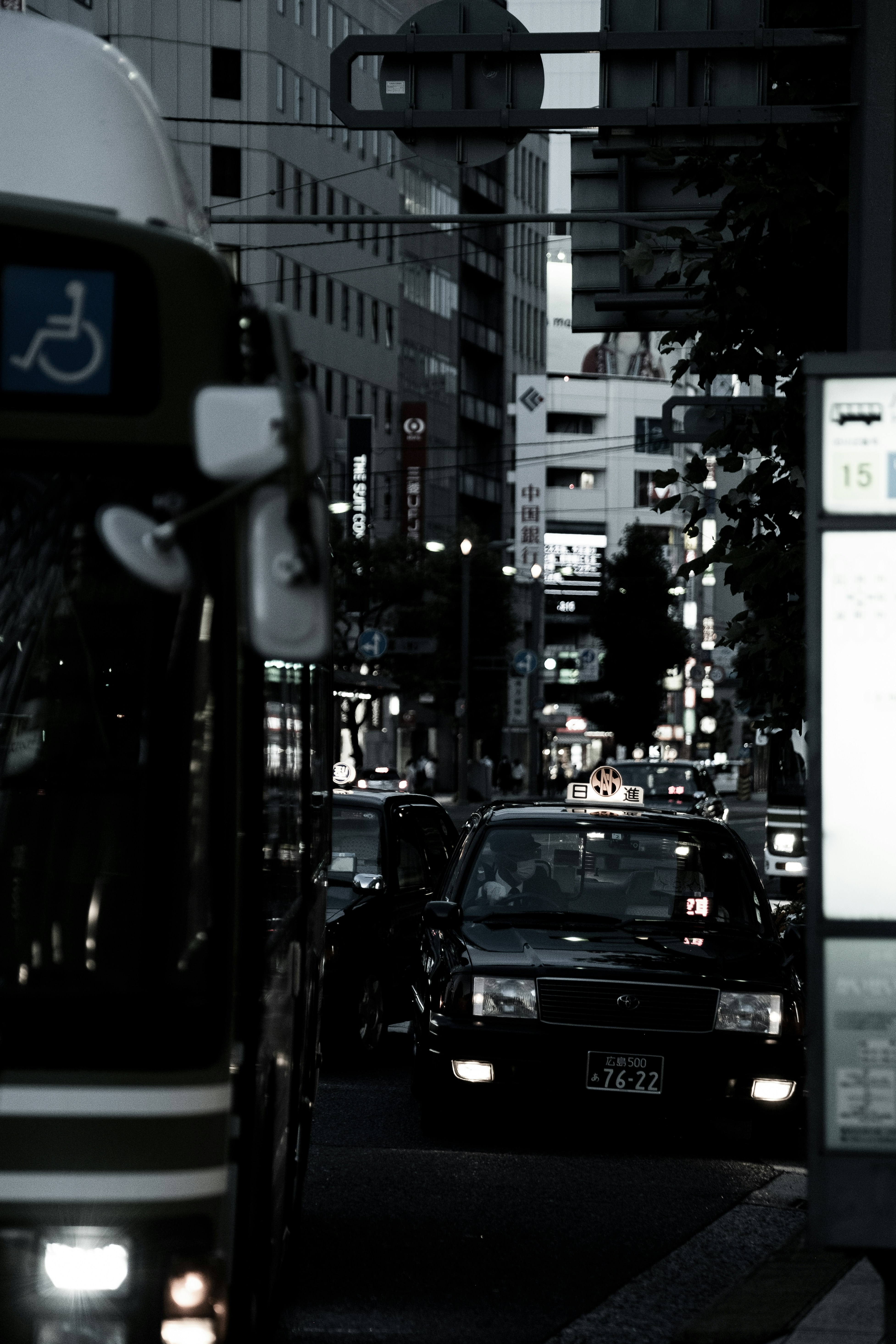 Taxi Convergence in a Neon-Drenched City Corridor