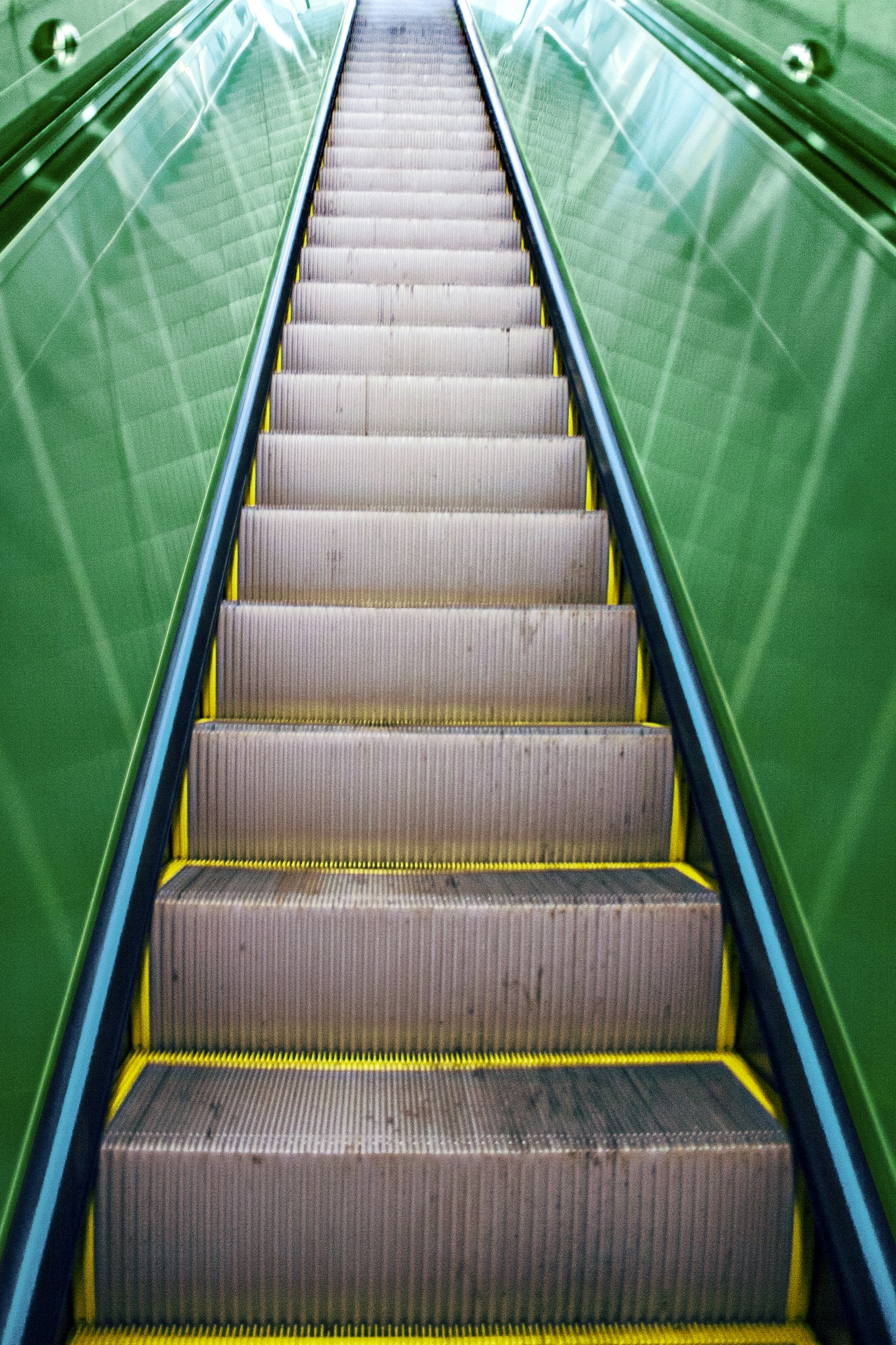 Emerald Ascent: Symmetry Toward the Escalator's Vanishing Point