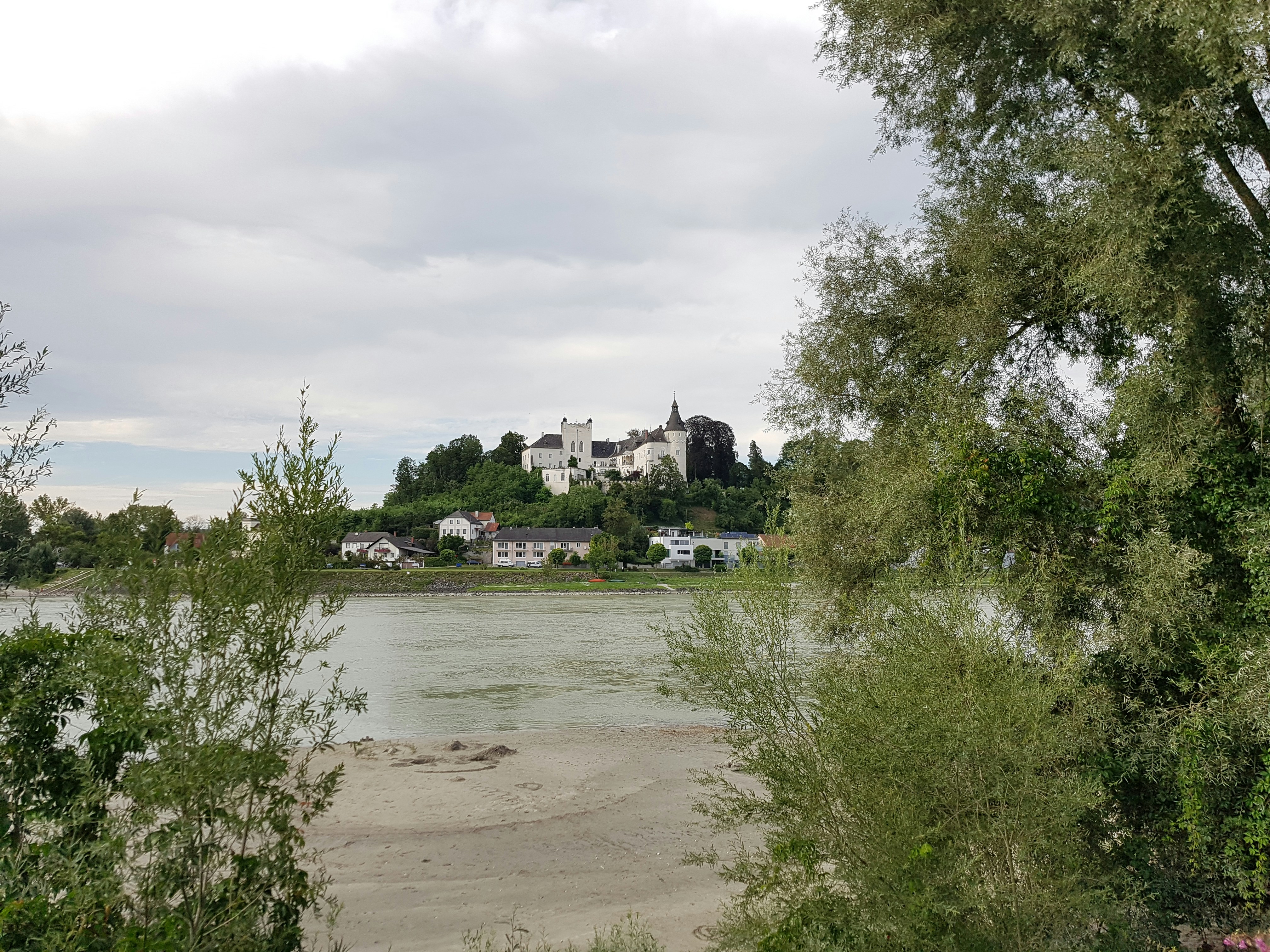 Riverside Village Crowned by a Hilltop Castle