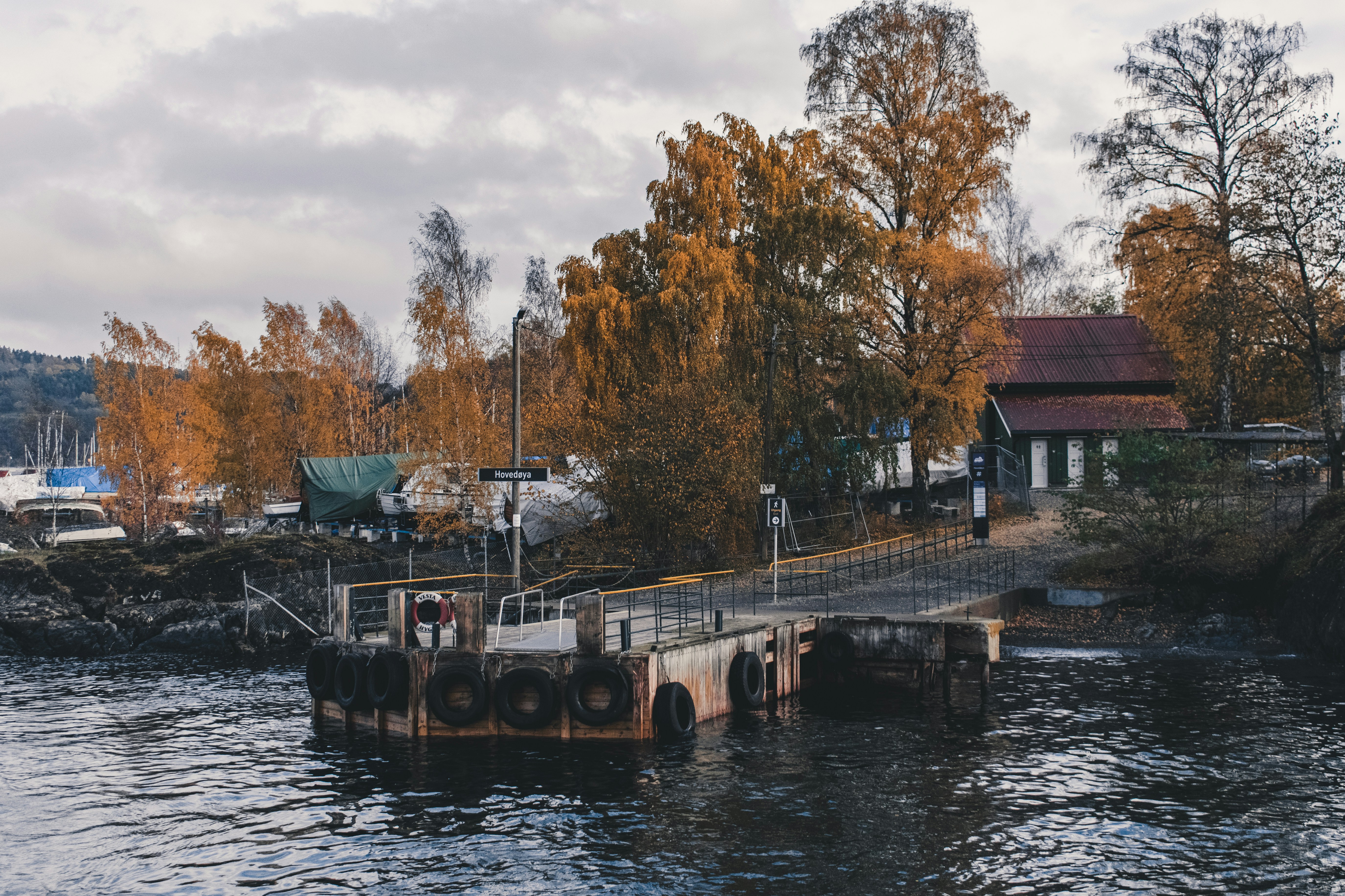 brown and white wooden boat on river during daytimeMary Ray
