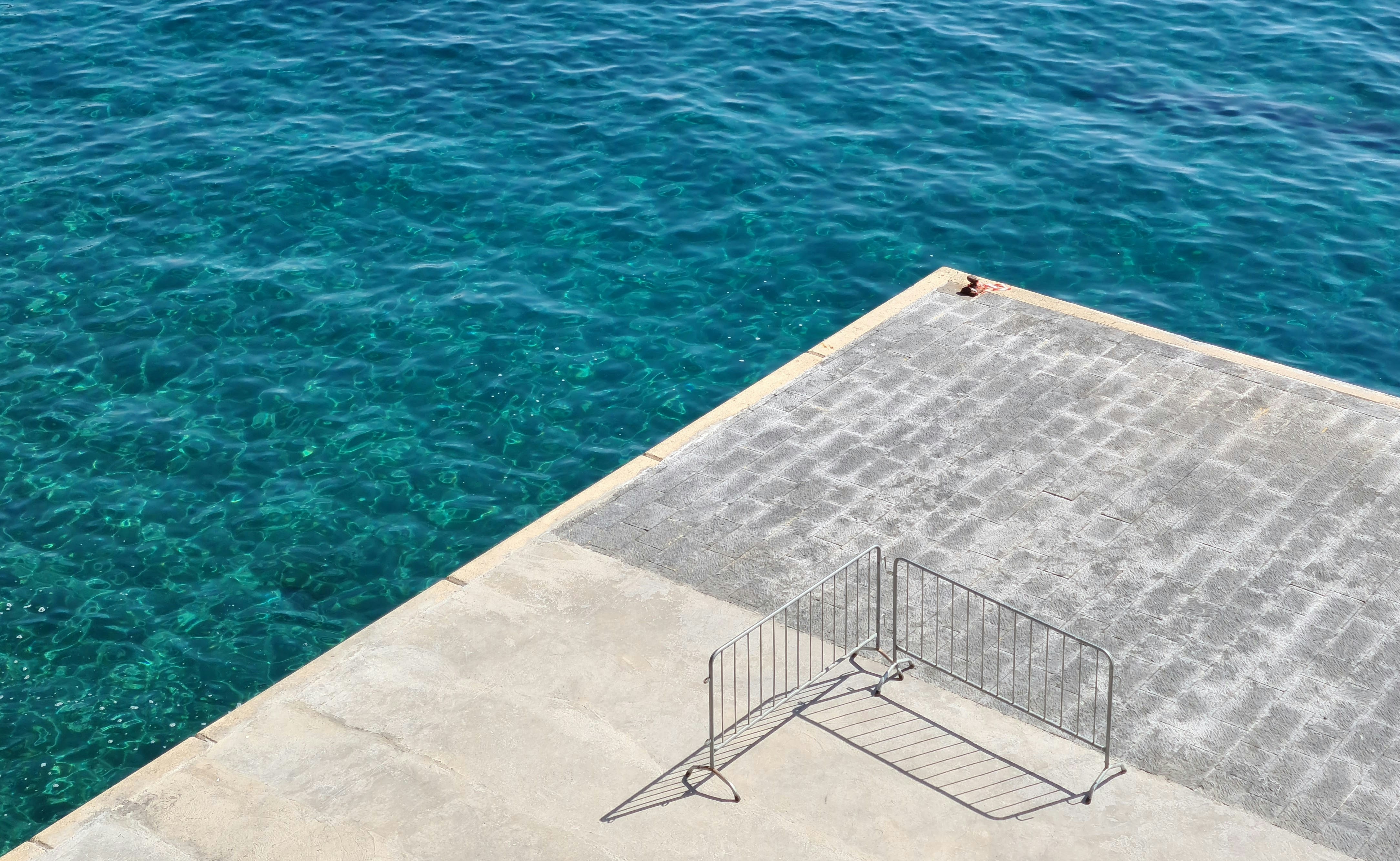 Turquoise Boundary: A Minimal Pier Framing the Open Sea